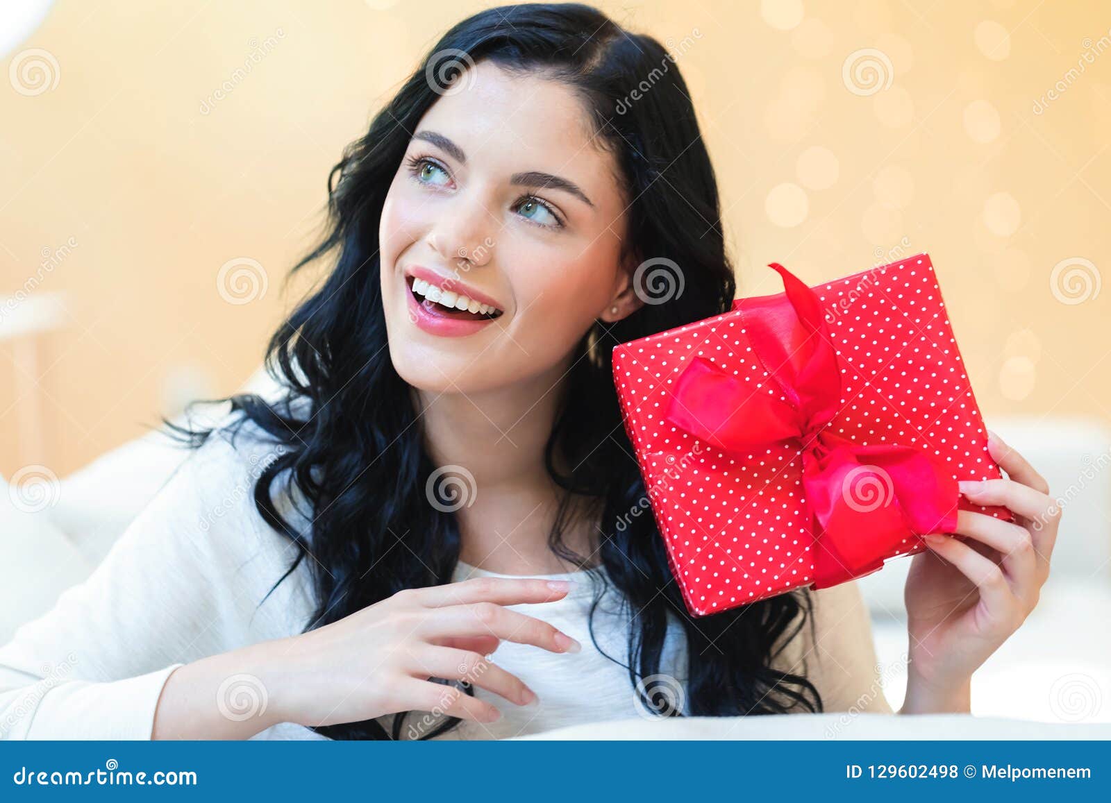 Young Woman Holding a Gift Box Stock Photo - Image of attractive, house ...