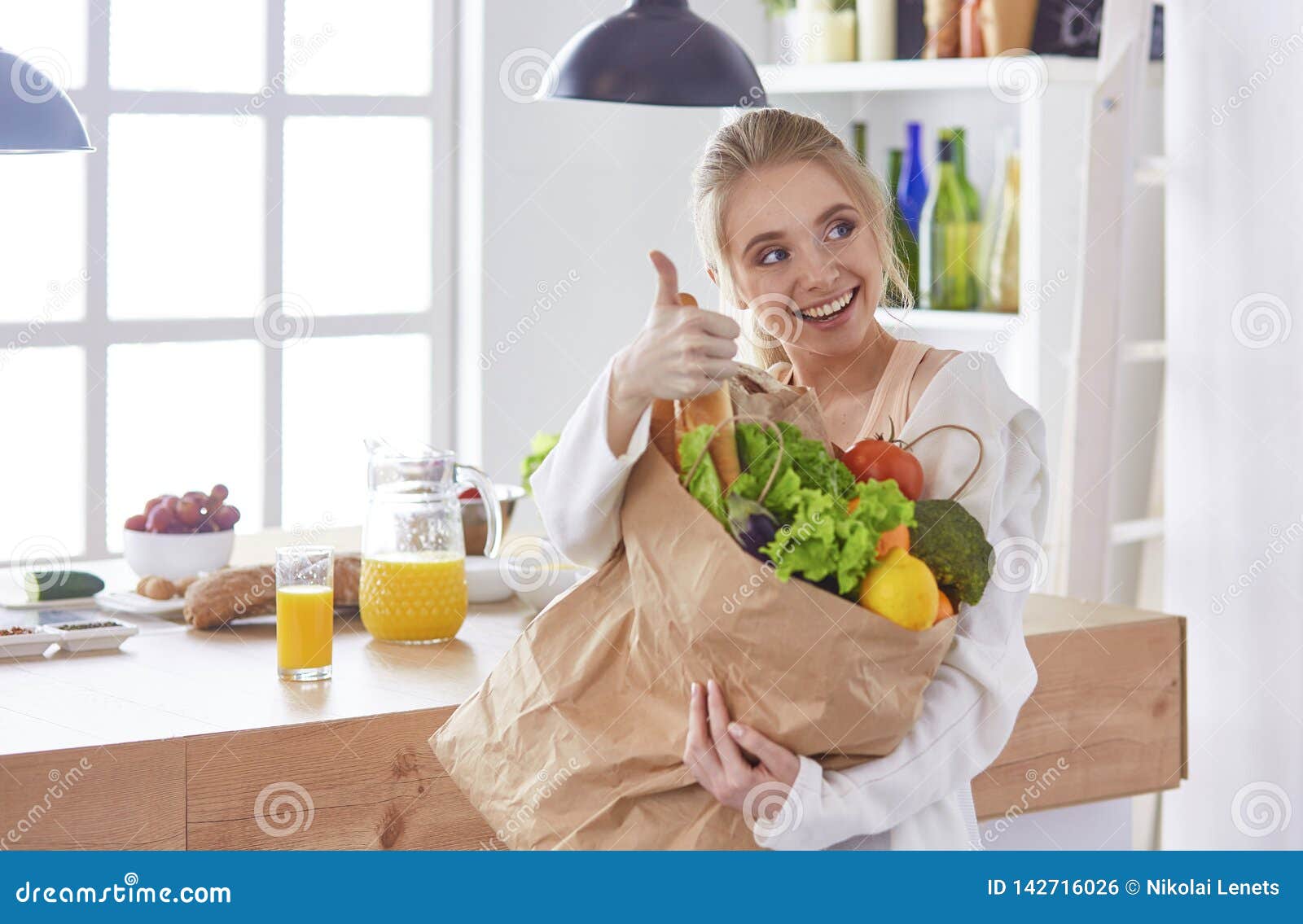 Young Woman Holding Grocery Shopping Bag with Vegetables Standi Stock ... Young Woman Holding Grocery Shopping Bag with Vegetables Standi Stock ...
