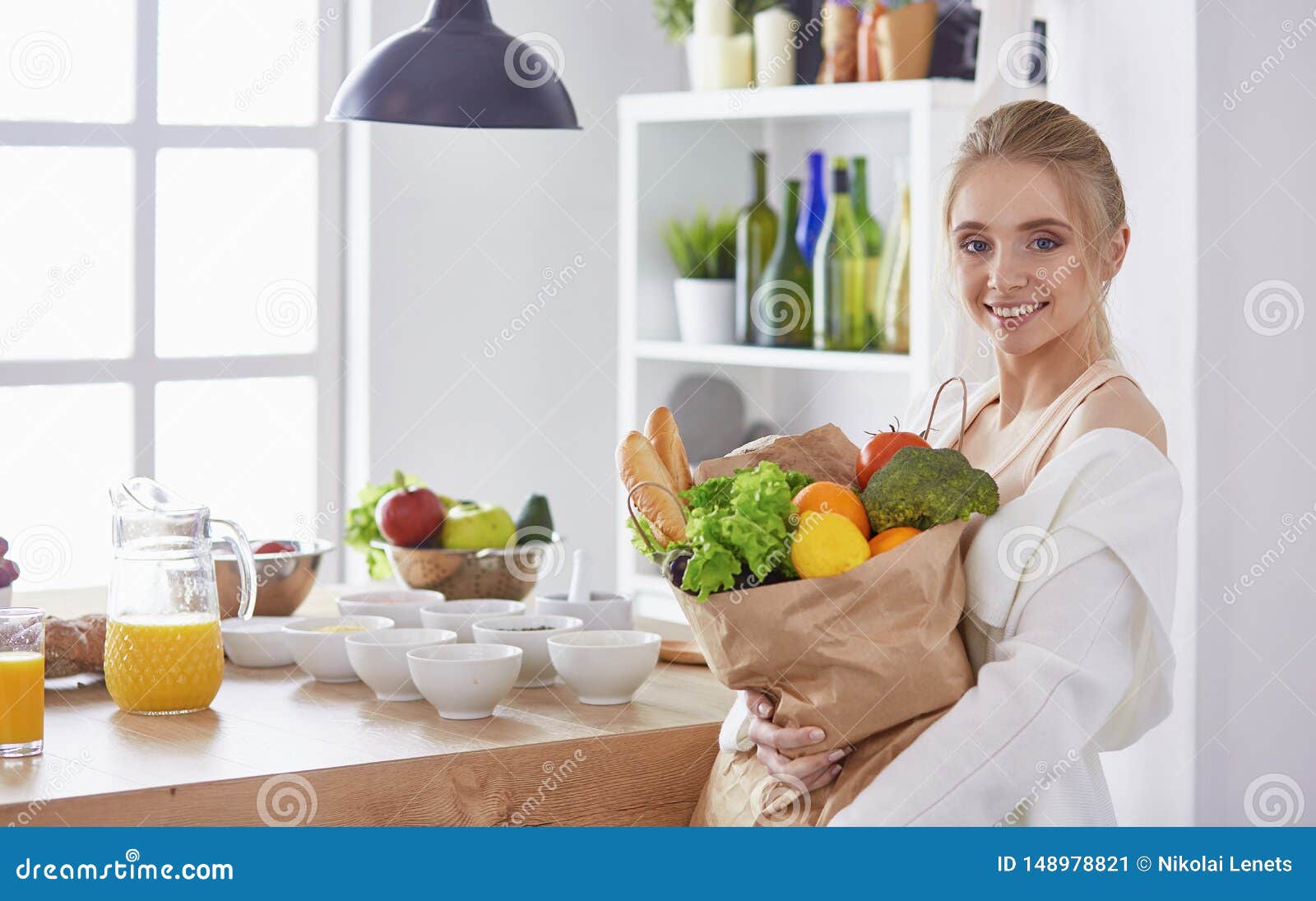 Young Woman Holding Grocery Shopping Bag with Vegetables Standi Stock ... Young Woman Holding Grocery Shopping Bag with Vegetables Standi Stock ...