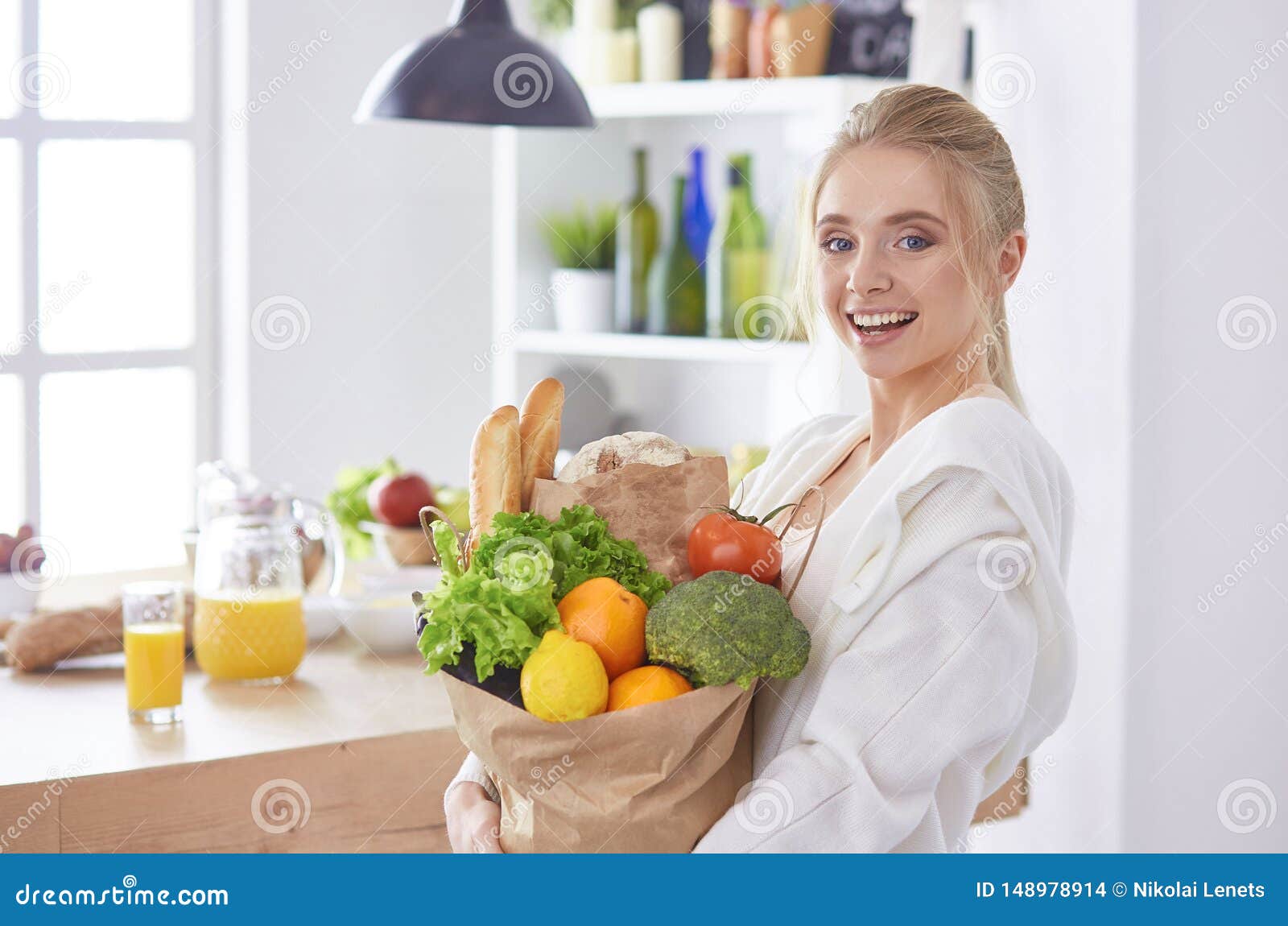 Young Woman Holding Grocery Shopping Bag with Vegetables Standi Stock ... Young Woman Holding Grocery Shopping Bag with Vegetables Standi Stock ...