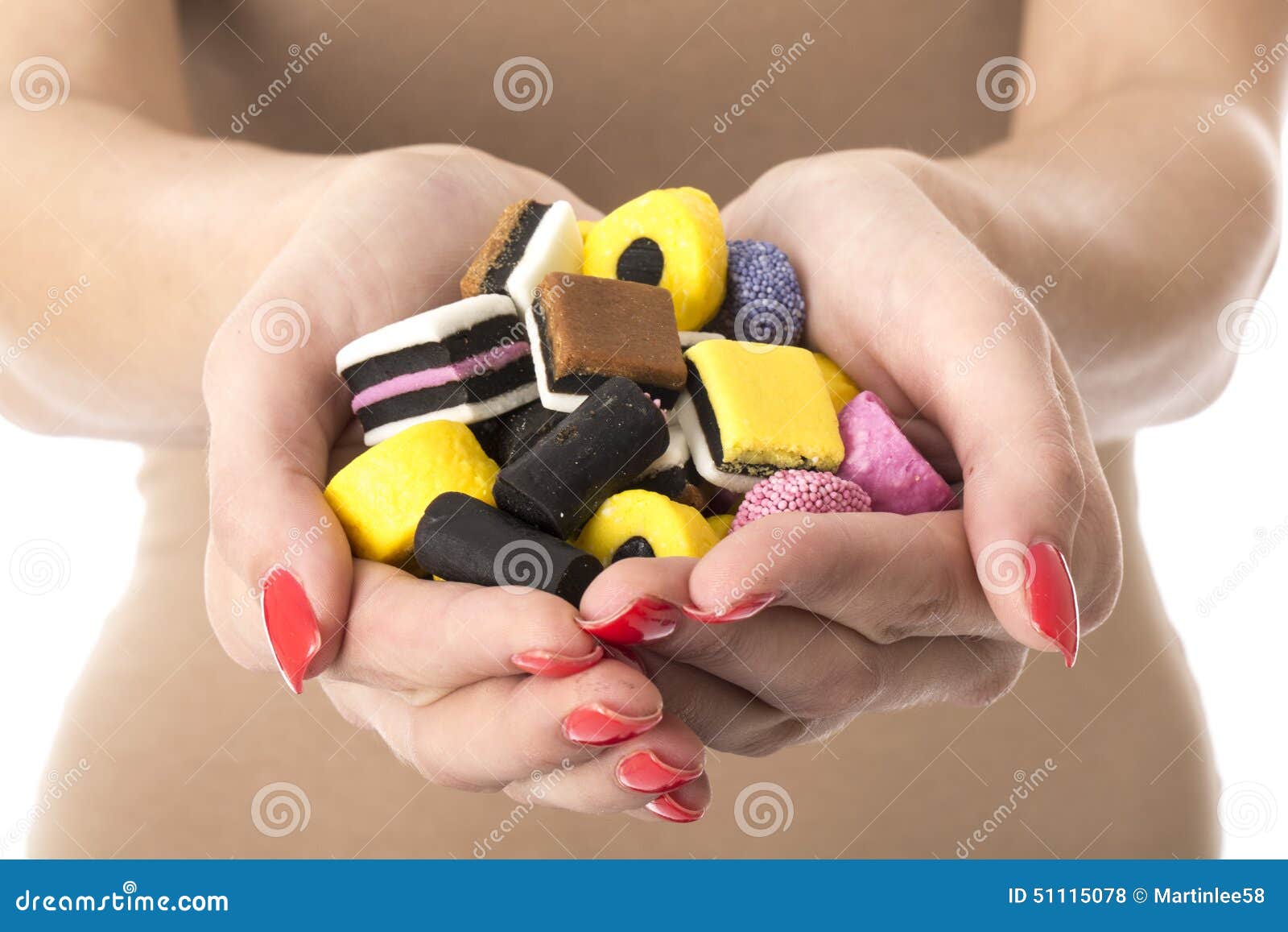 Young Woman Holding a Handful of Sweets Stock Photo - Image of isolated ...