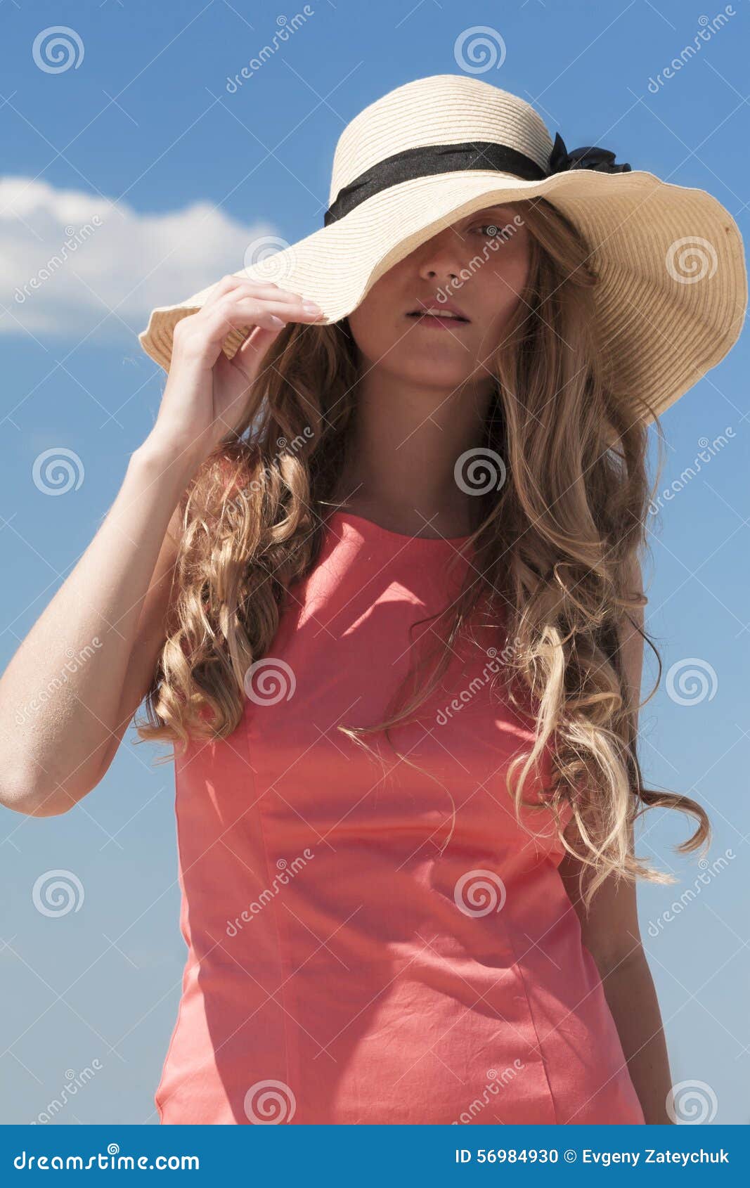 Young Woman Holding Her Hat with One Hand Stock Photo - Image of cute ... Young Woman Holding Her Hat with One Hand Stock Photo - Image of cute ...