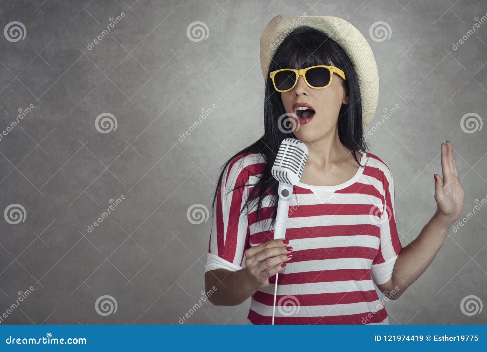 Young Woman Holding a Microphone Singing Stock Image - Image of ...