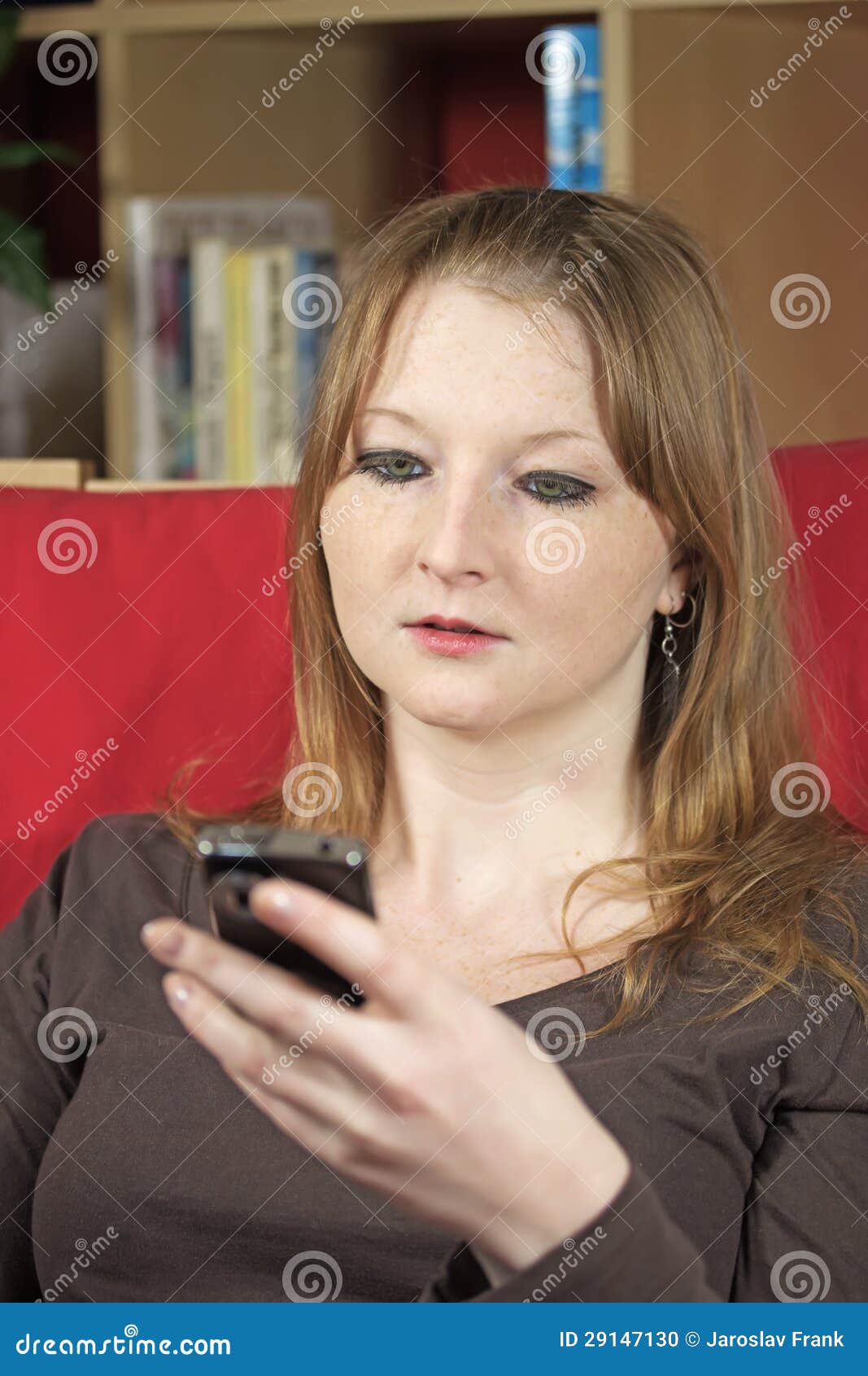 Young Woman is Holding a Mobile Phone. Stock Photo - Image of ...