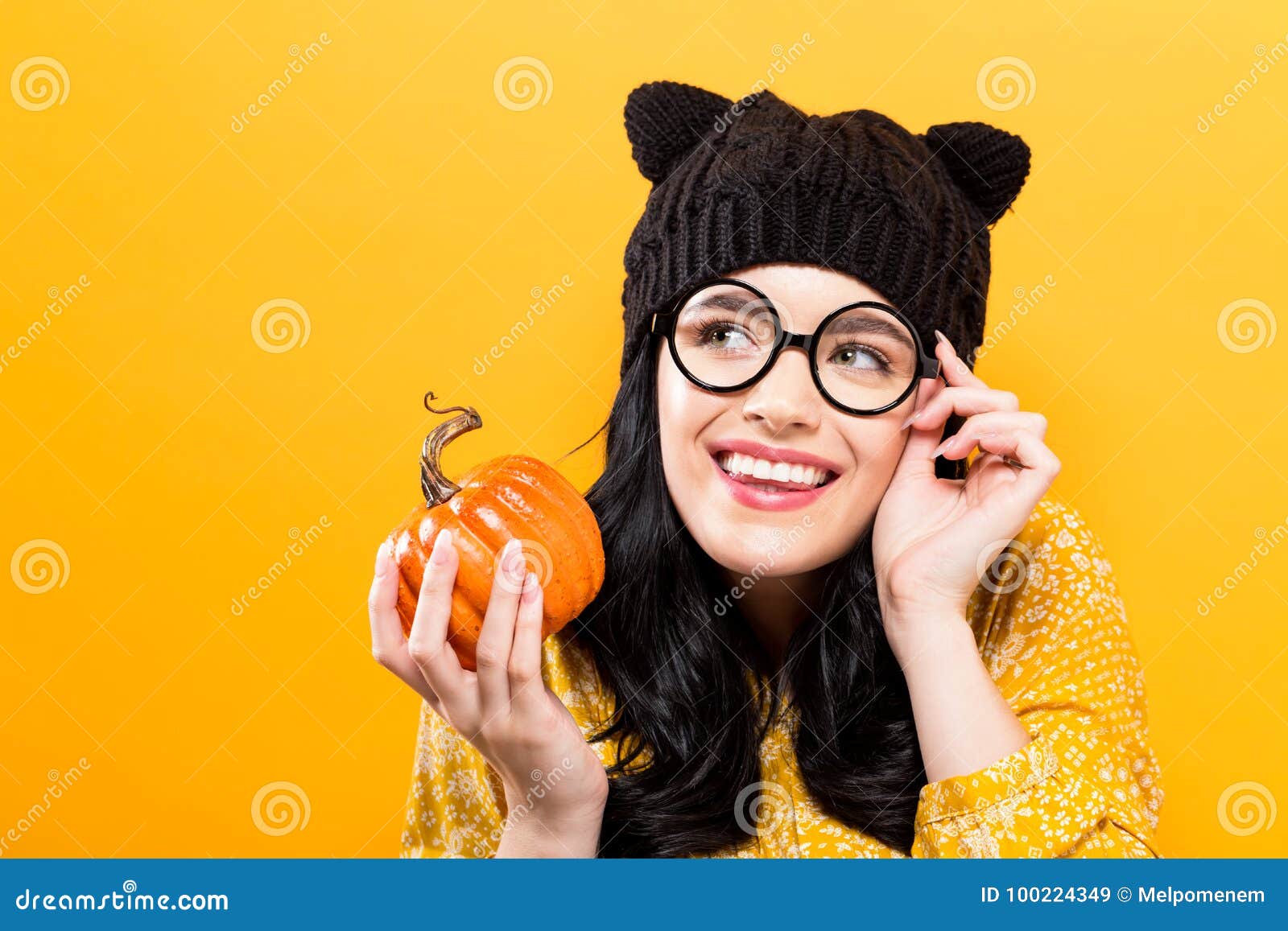 Young Woman Holding a Pumpkin Stock Image - Image of color, cute: 100224349 Young Woman Holding a Pumpkin Stock Image - Image of color, cute: 100224349