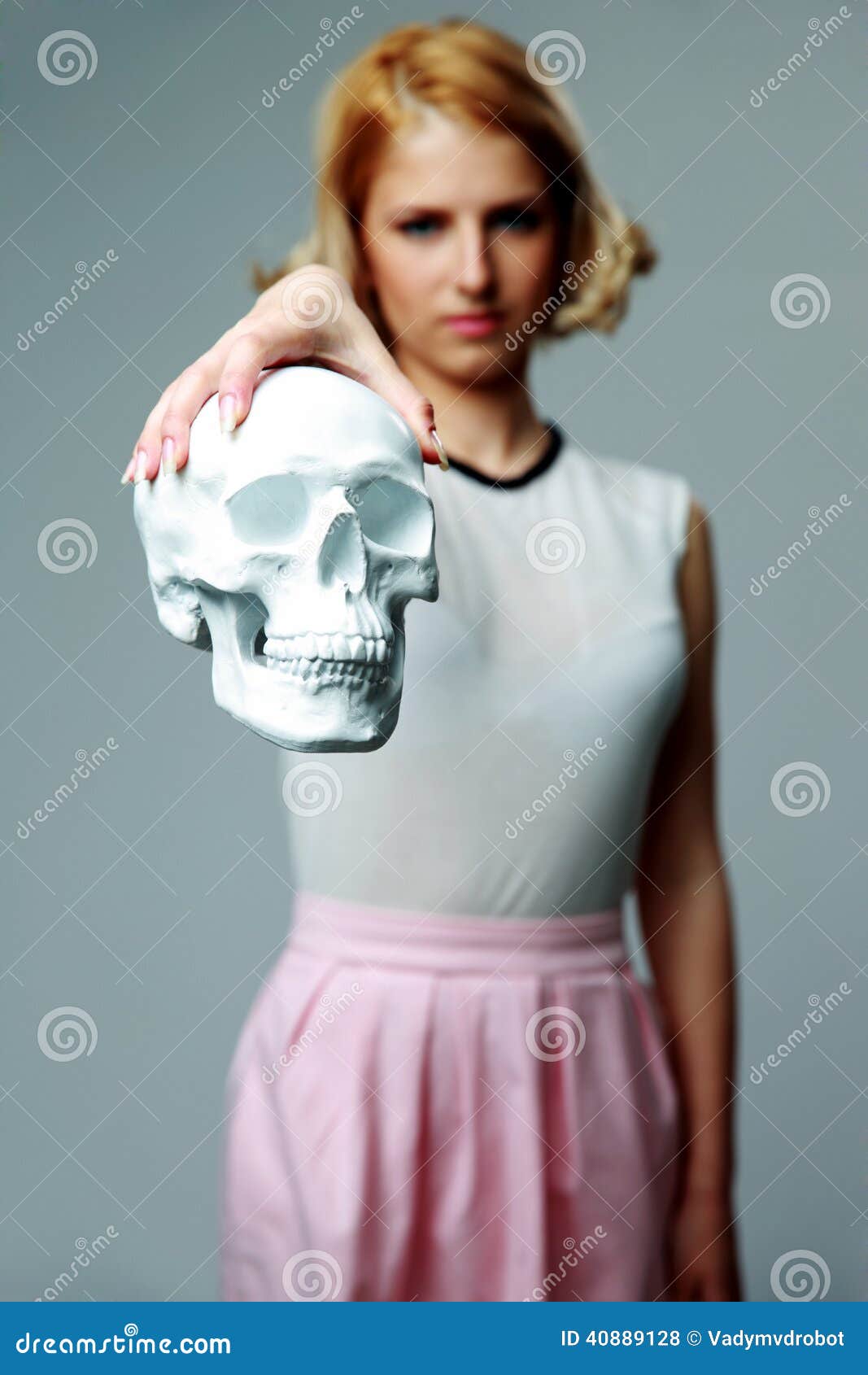 Young woman holding skull stock photo. Image of isolated - 40889128
