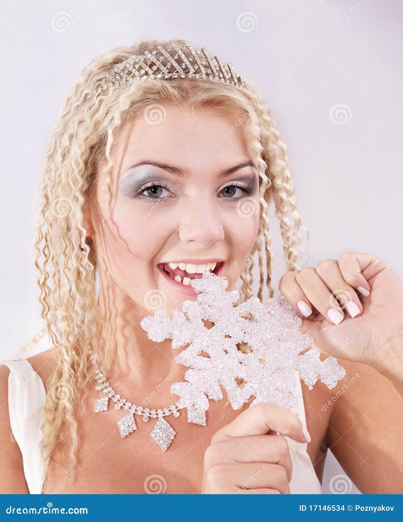Young Woman Holding Snowflake. Stock Photo - Image of blond, blue: 17146534