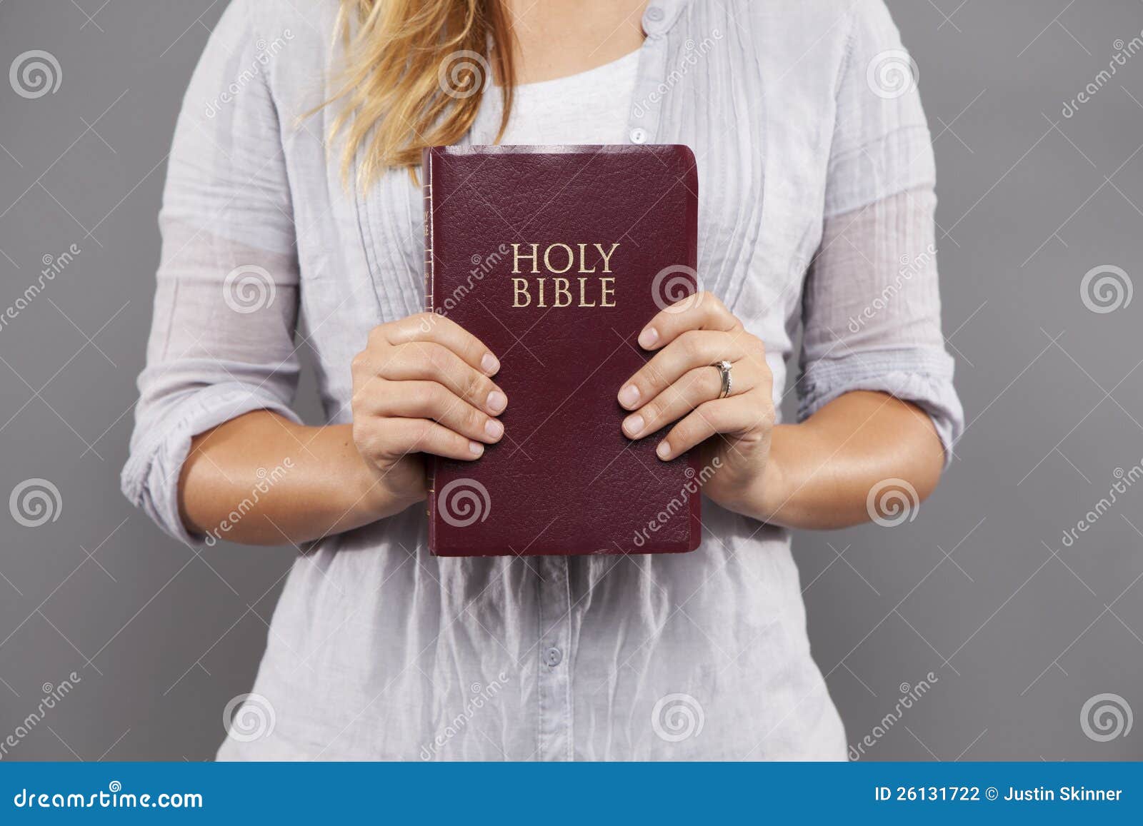 Young Woman Holds Maroon Bible Stock Photo - Image of hold, person ...