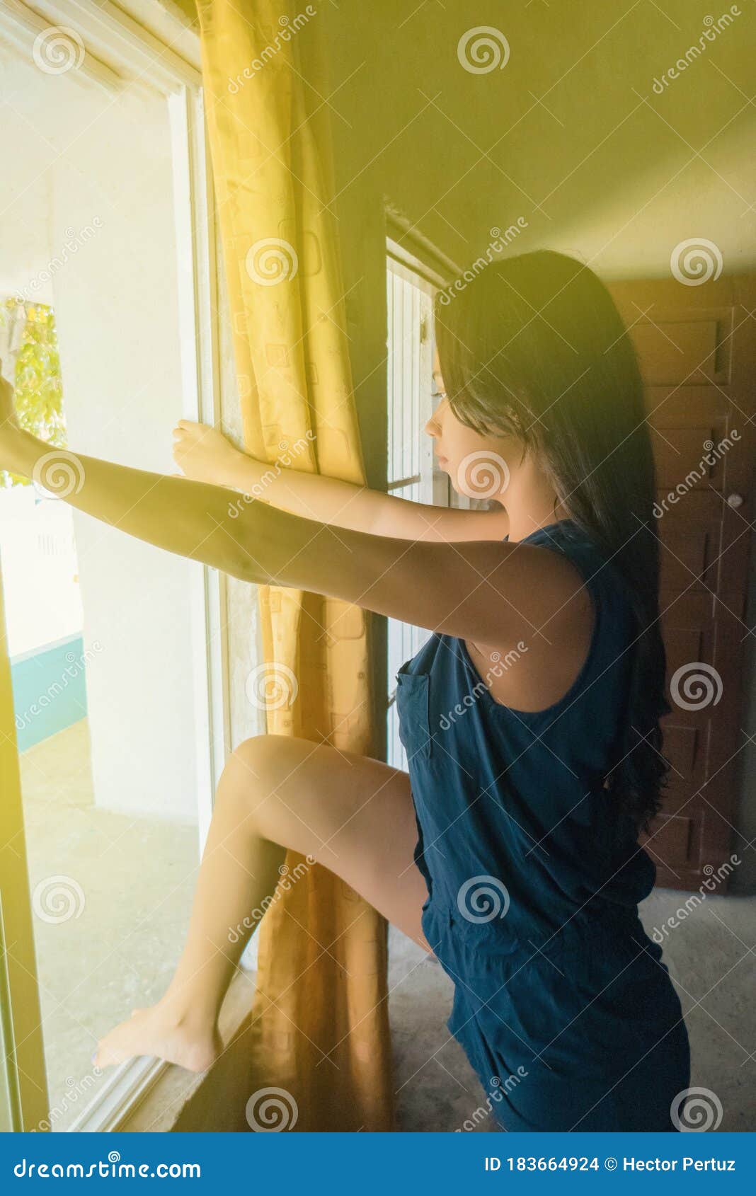 A Young Woman At Home Going Out The Window Stock Photo - Image of ...