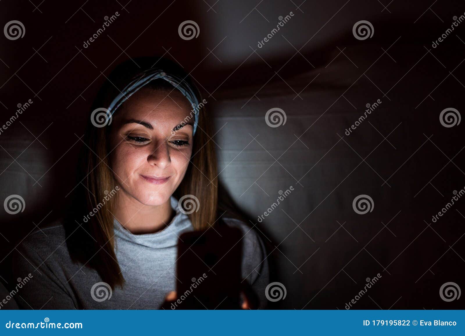 Young Woman at Home Using Mobile Phone. Night Time Stock Photo - Image ...