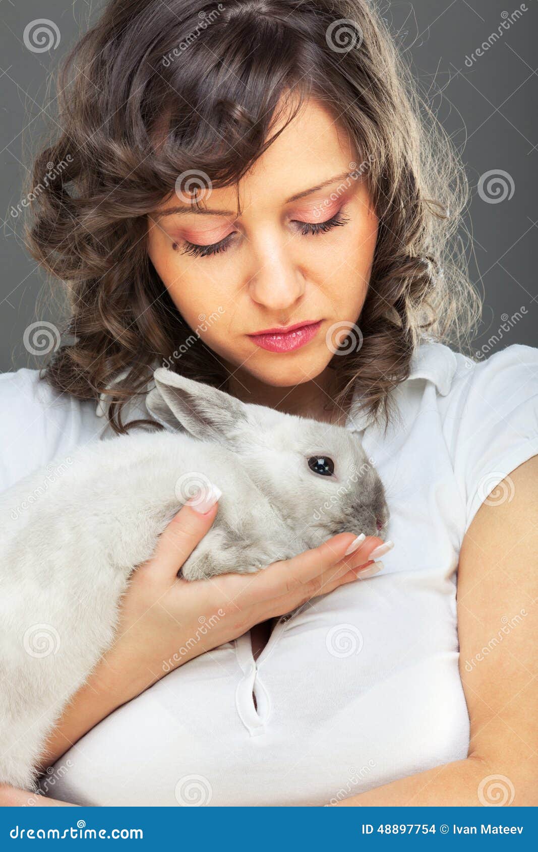 Young woman hugging rabbit stock photo. Image of smile - 48897754