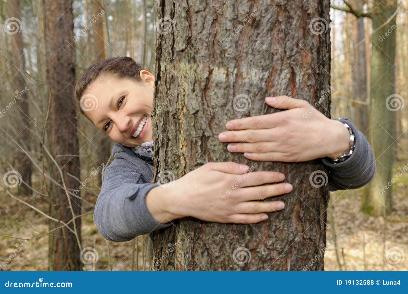 Young woman hugging a tree stock photo. Image of shot - 19132588