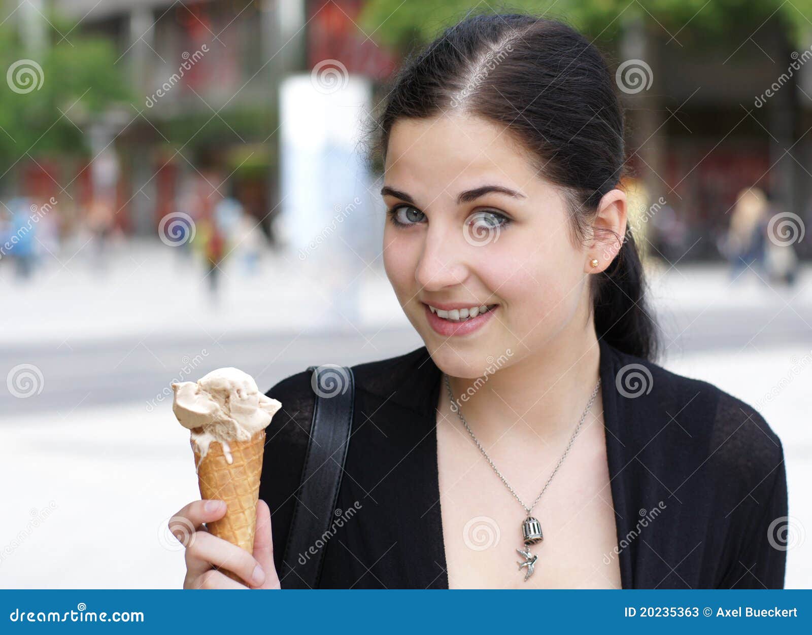 Young Woman with Ice Cream Cone Stock Image - Image of dark, contact ...