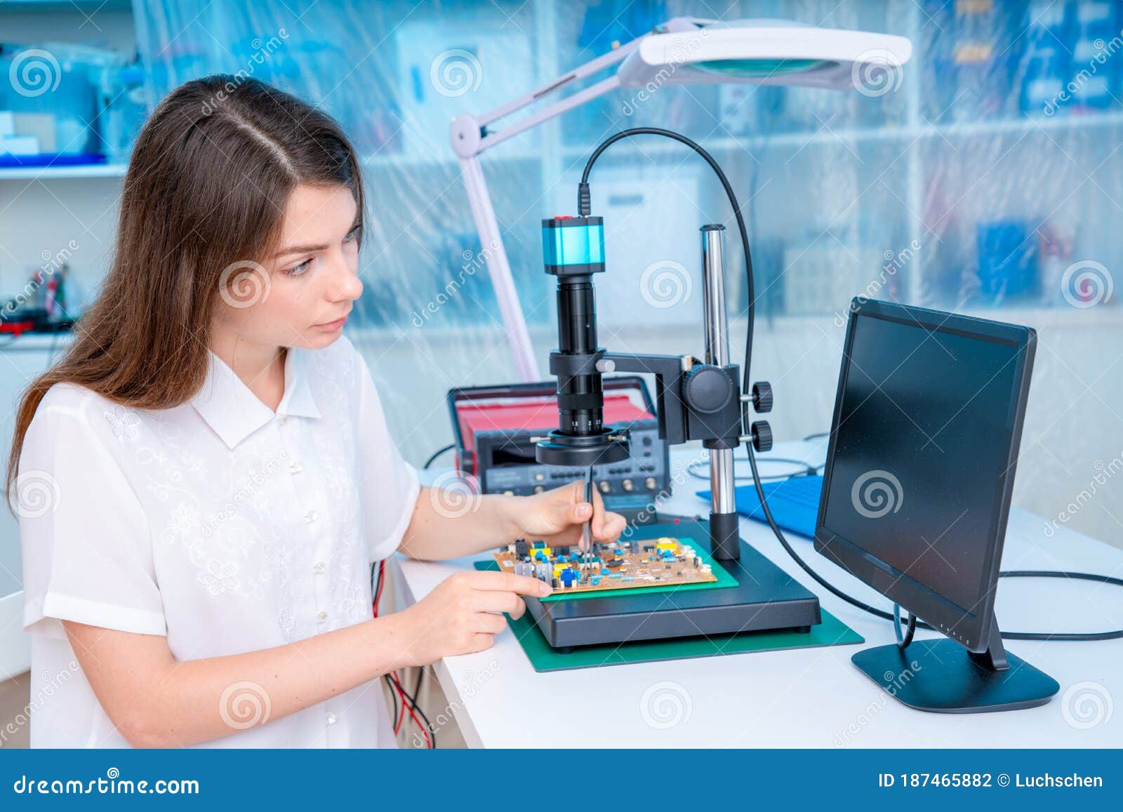 Young Woman in Inspection Electronics PCB Devise. Modern Electronics ...
