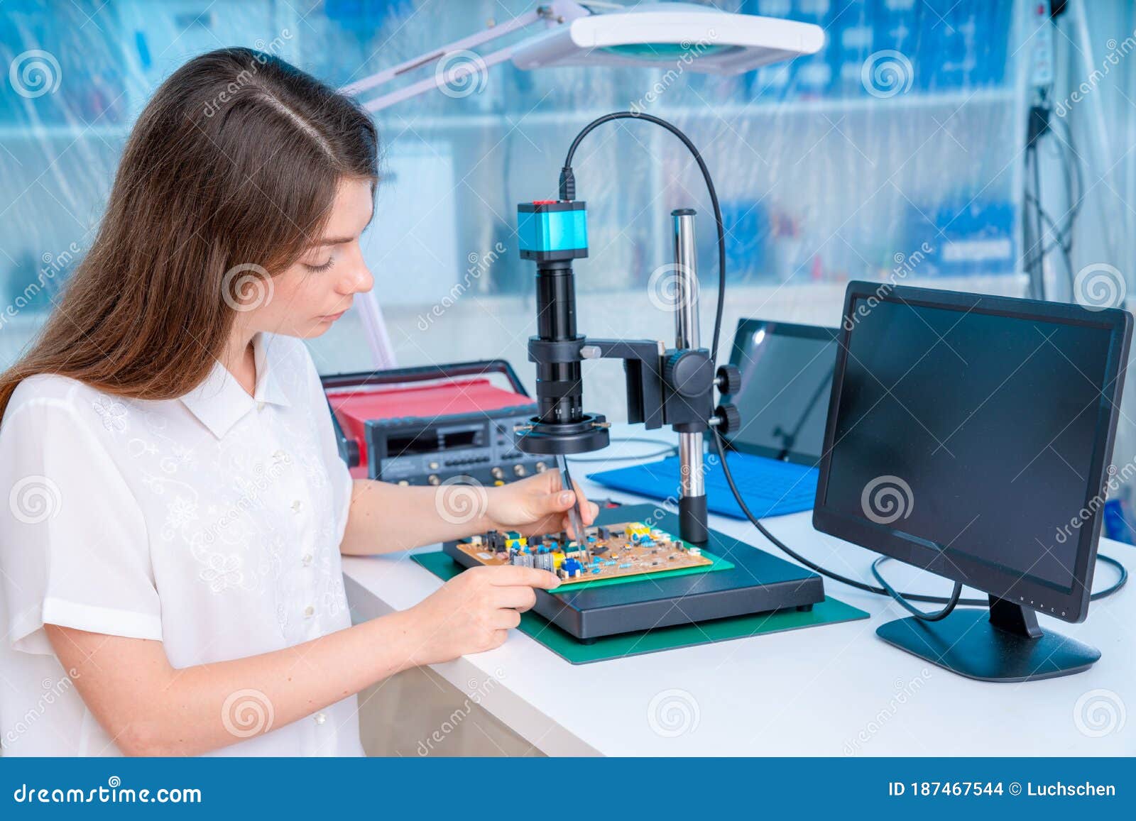 Young Woman in Inspection Electronics PCB Devise. Modern Electronics ...