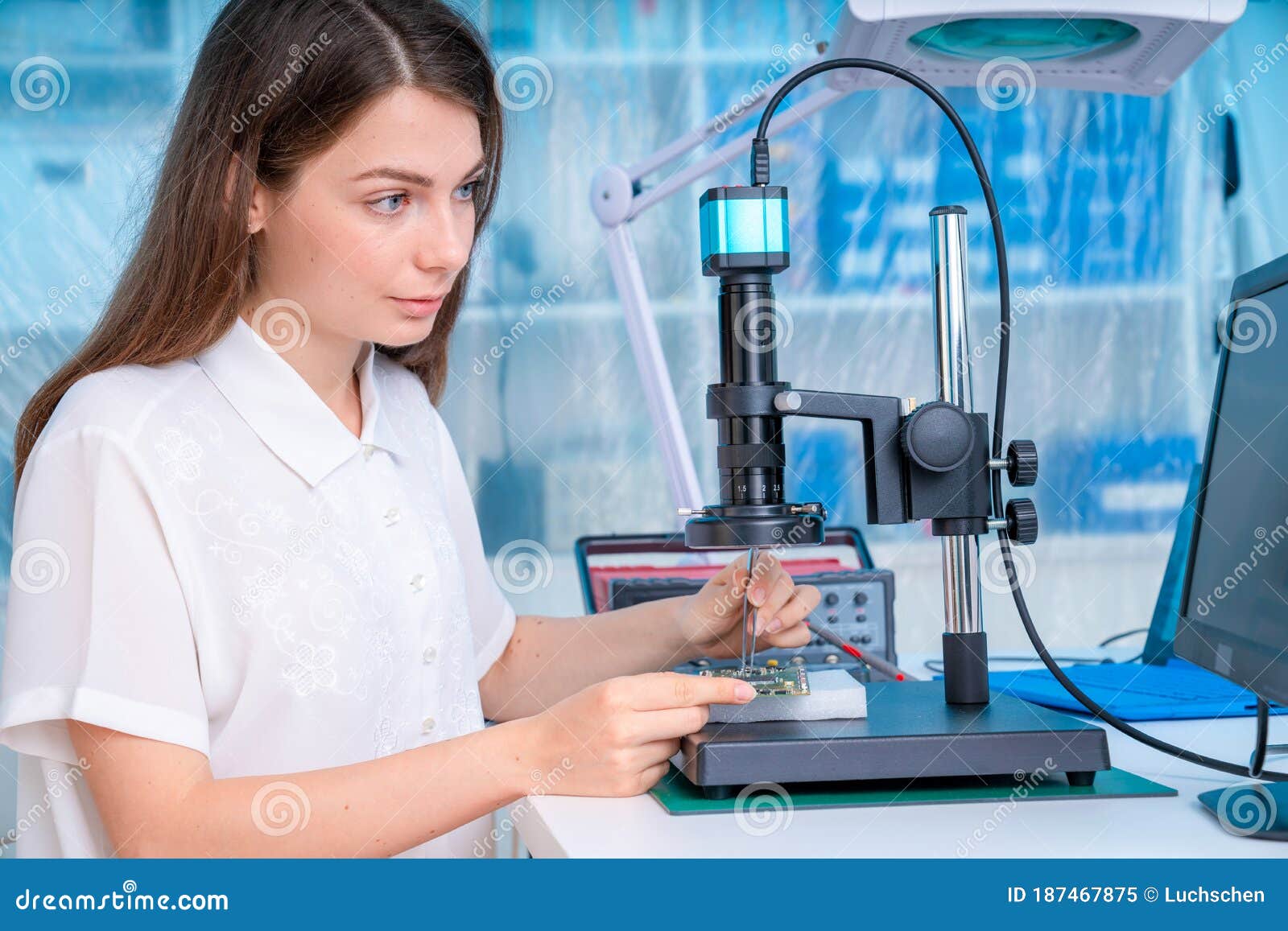 Young Woman in Inspection Electronics PCB Devise. Modern Electronics ...
