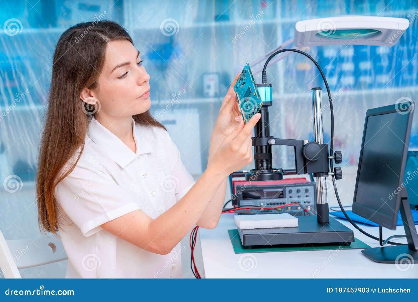 Young Woman in Inspection Electronics PCB Devise. Modern Electronics ...