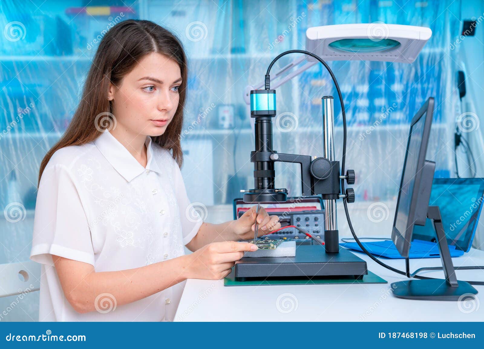 Young Woman in Inspection Electronics PCB Devise. Modern Electronics ...