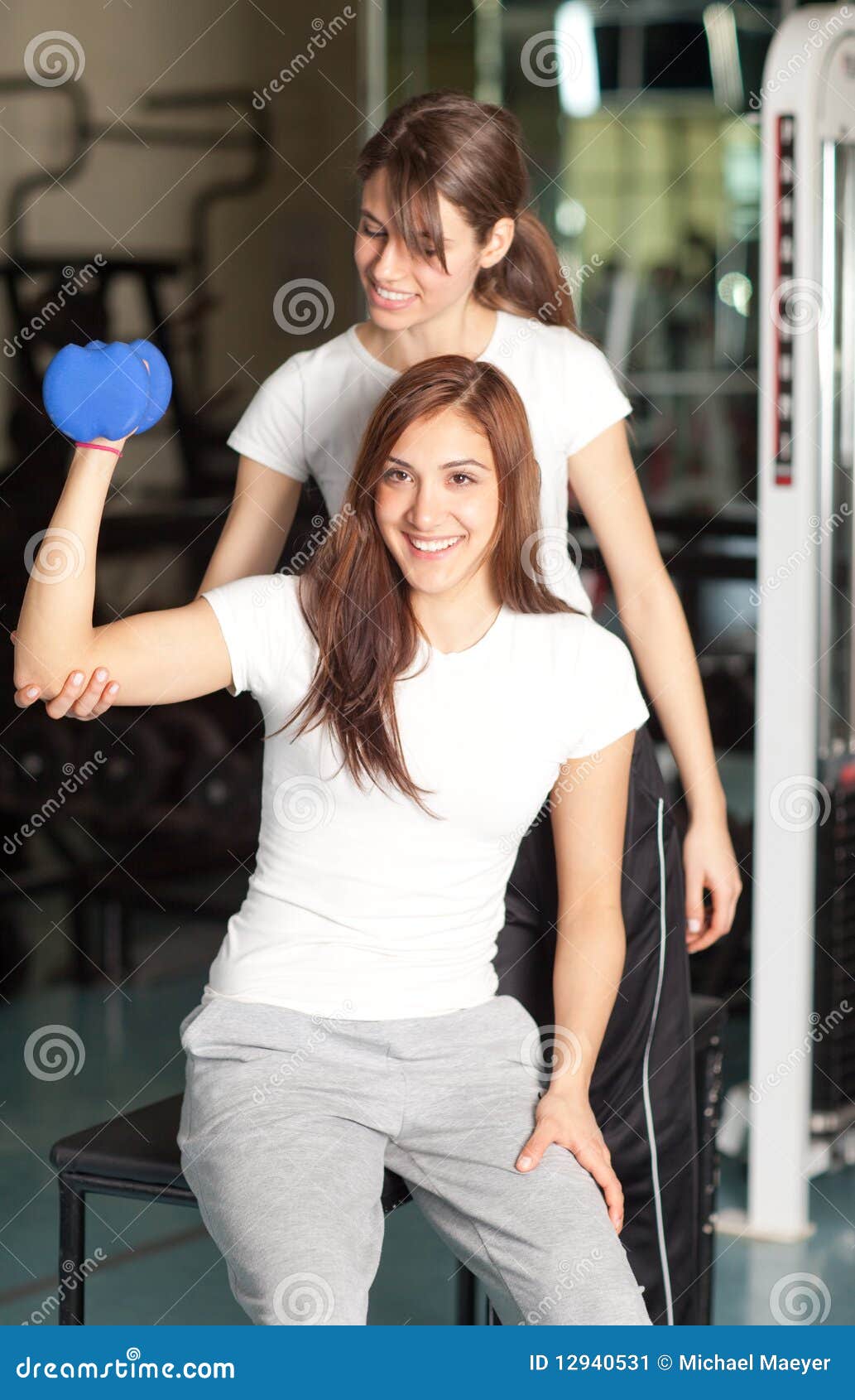 Young Woman and Instructor in the Gym Stock Image - Image of curl ...