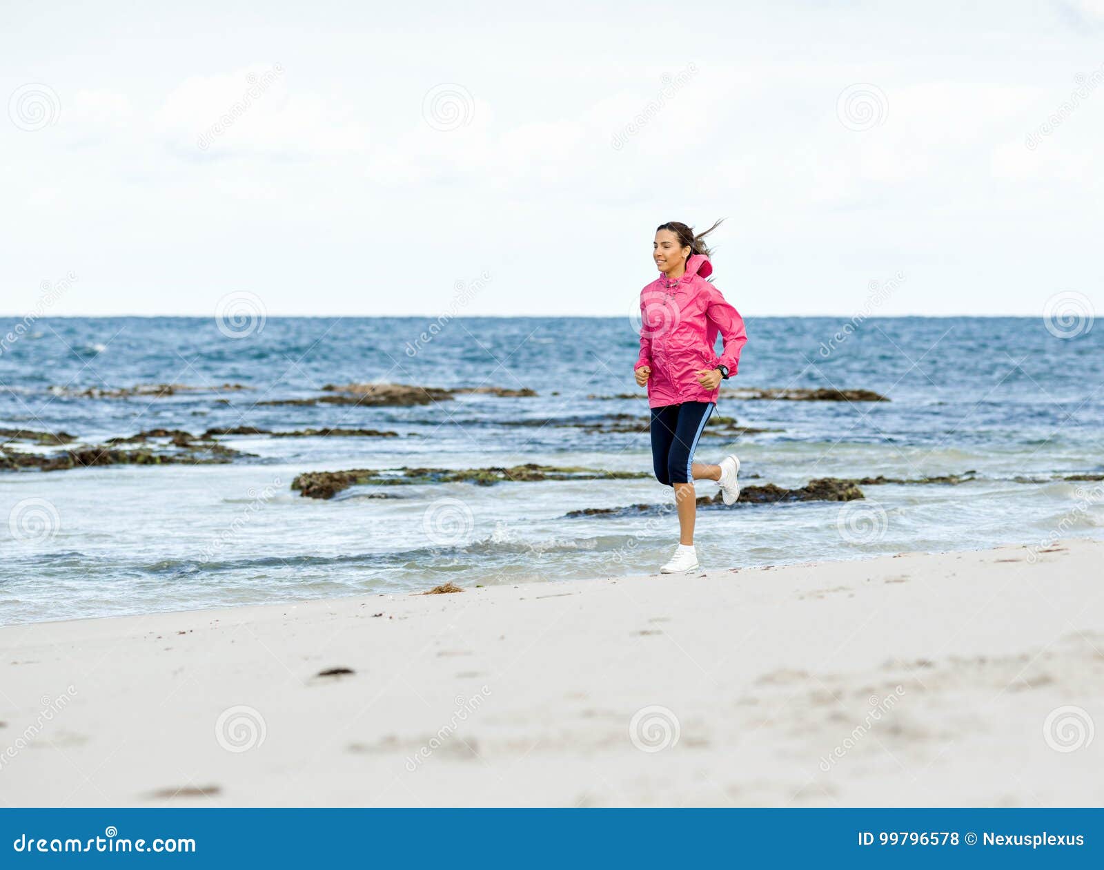 Young Woman Jogging on the Beach Stock Photo - Image of runner ...
