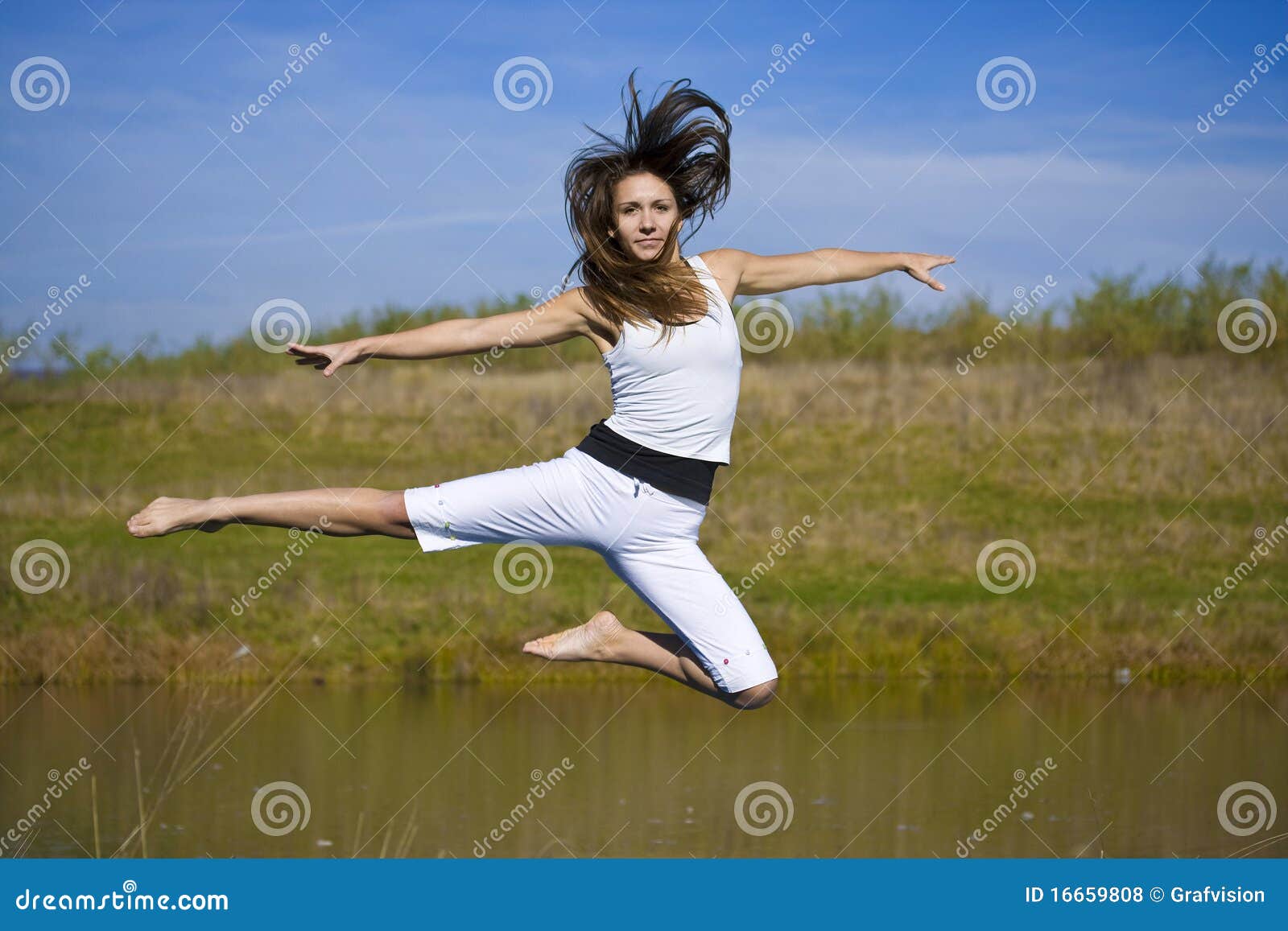 Young woman jumping stock photo. Image of girl, beauty - 16659808