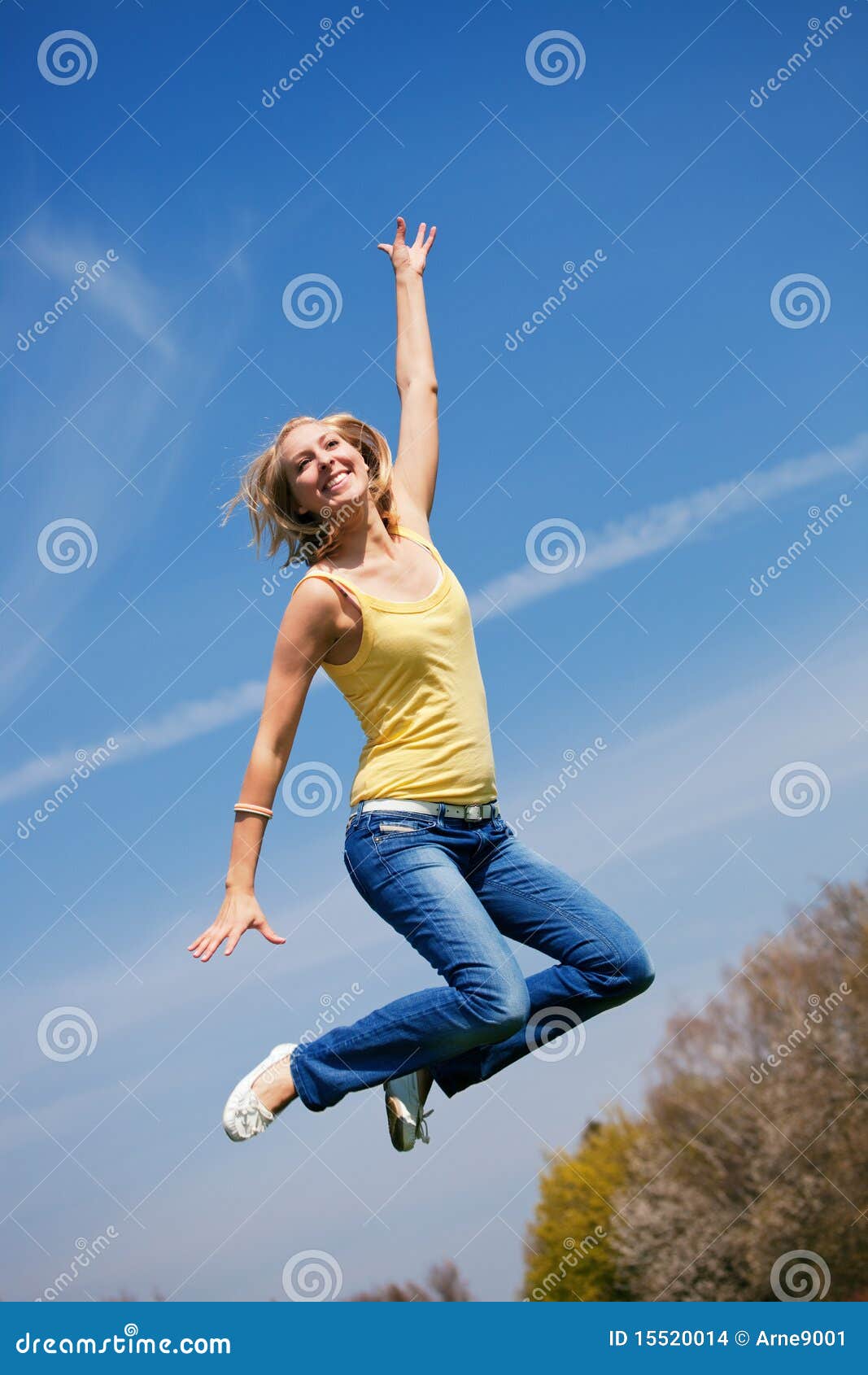 Young woman jumping high stock photo. Image of blond - 15520014