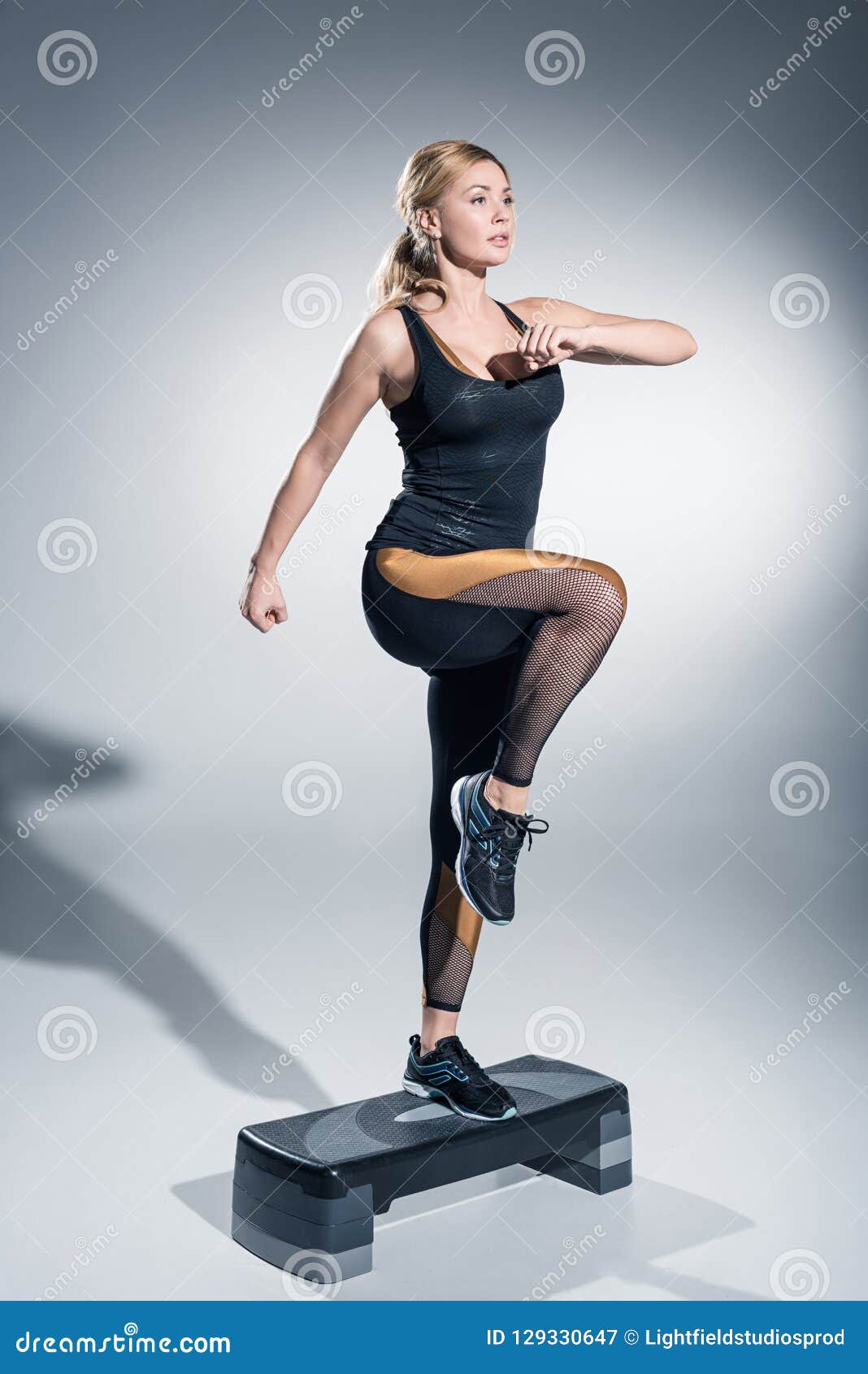 Young Woman Jumping on Step Platform Stock Image - Image of platform ...