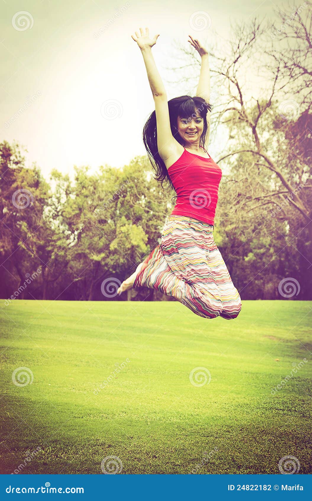 Young woman jumping up stock photo. Image of sunny, green - 24822182