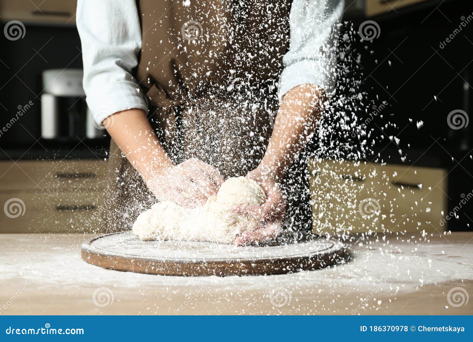 Young Woman Kneading Dough at Table in Kitchen Stock Photo - Image of ...