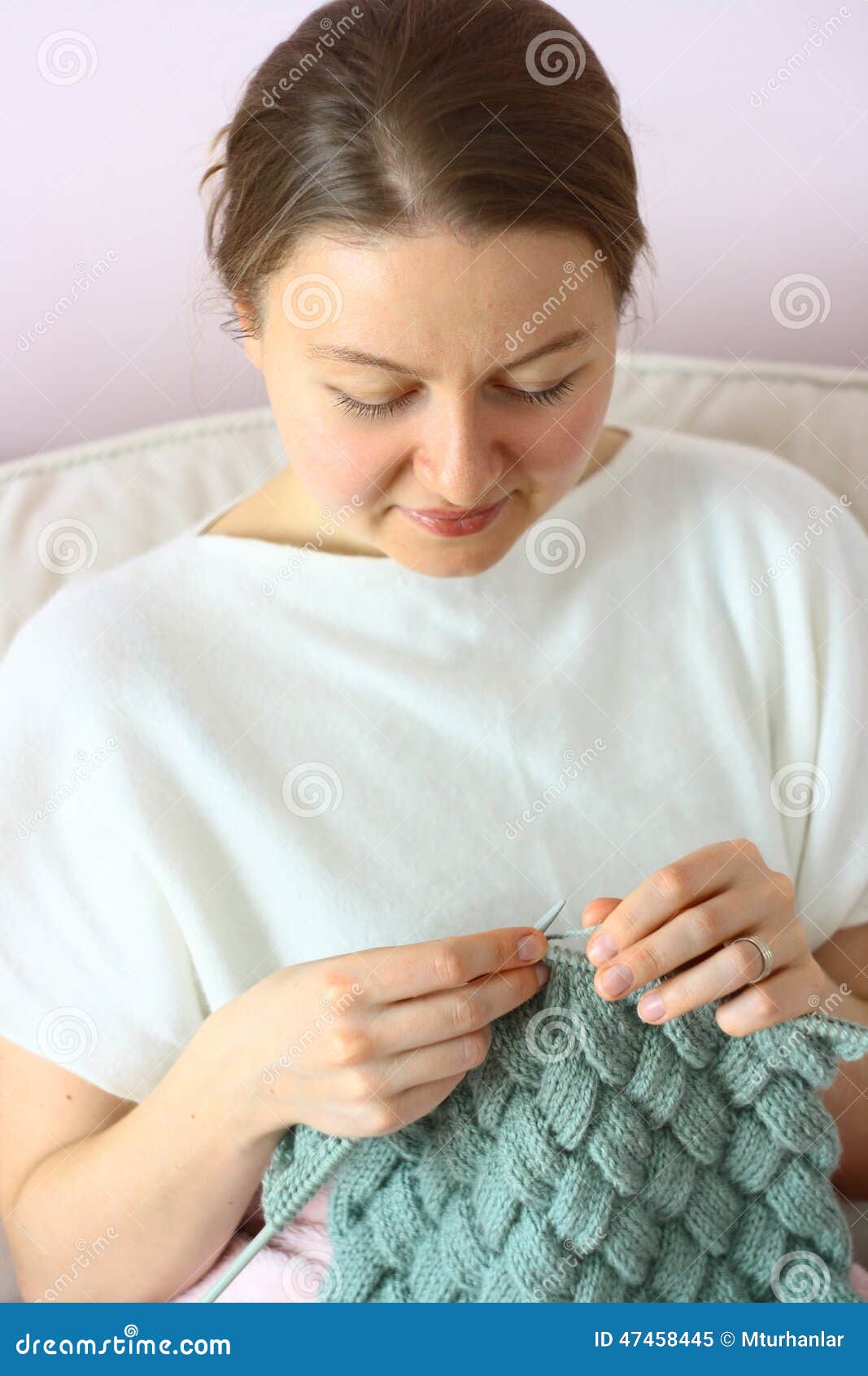 Young woman knitting stock image. Image of needlework - 47458445