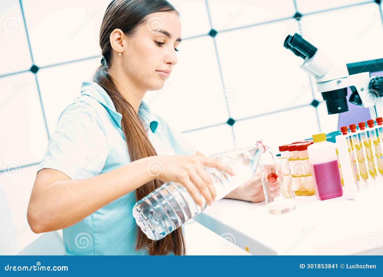 Young Woman in the Laboratory Measures the Acidity of Drinking Water ...