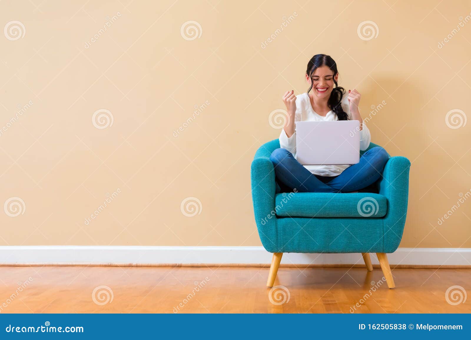 Young Woman with a Laptop Computer with Successful Pose Stock Photo ...