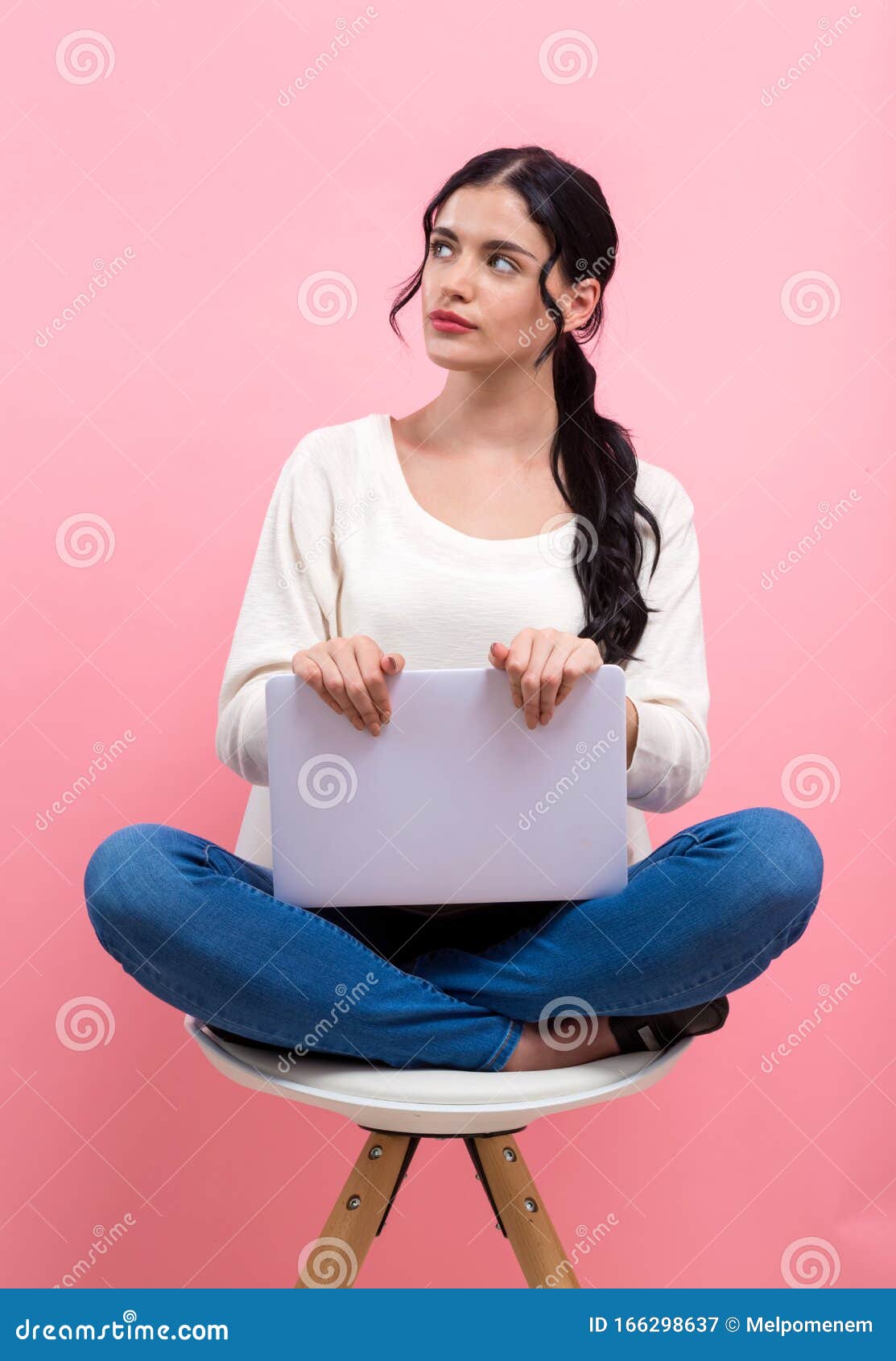 Young Woman with a Laptop Computer in a Thoughtful Pose Stock Image ...