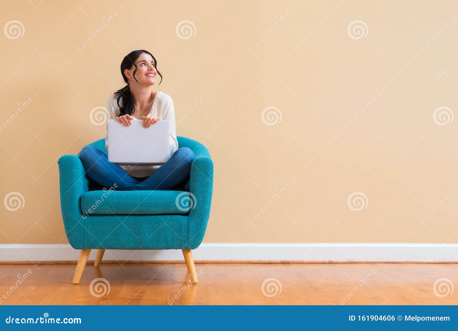 Young Woman with a Laptop Computer in a Thoughtful Pose Stock Photo ...