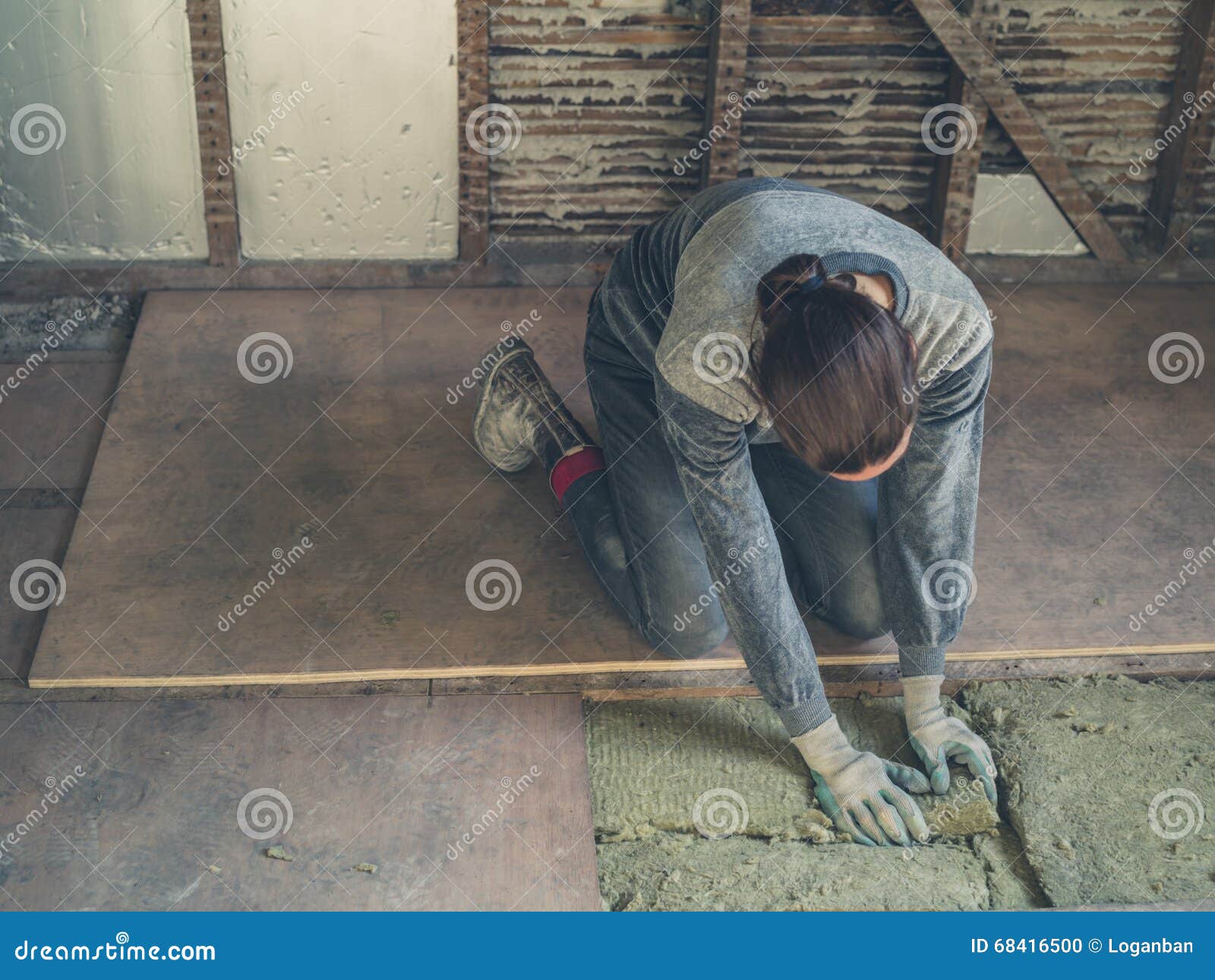 Young Woman Laying Insulation in Loft Stock Photo - Image of floor ...