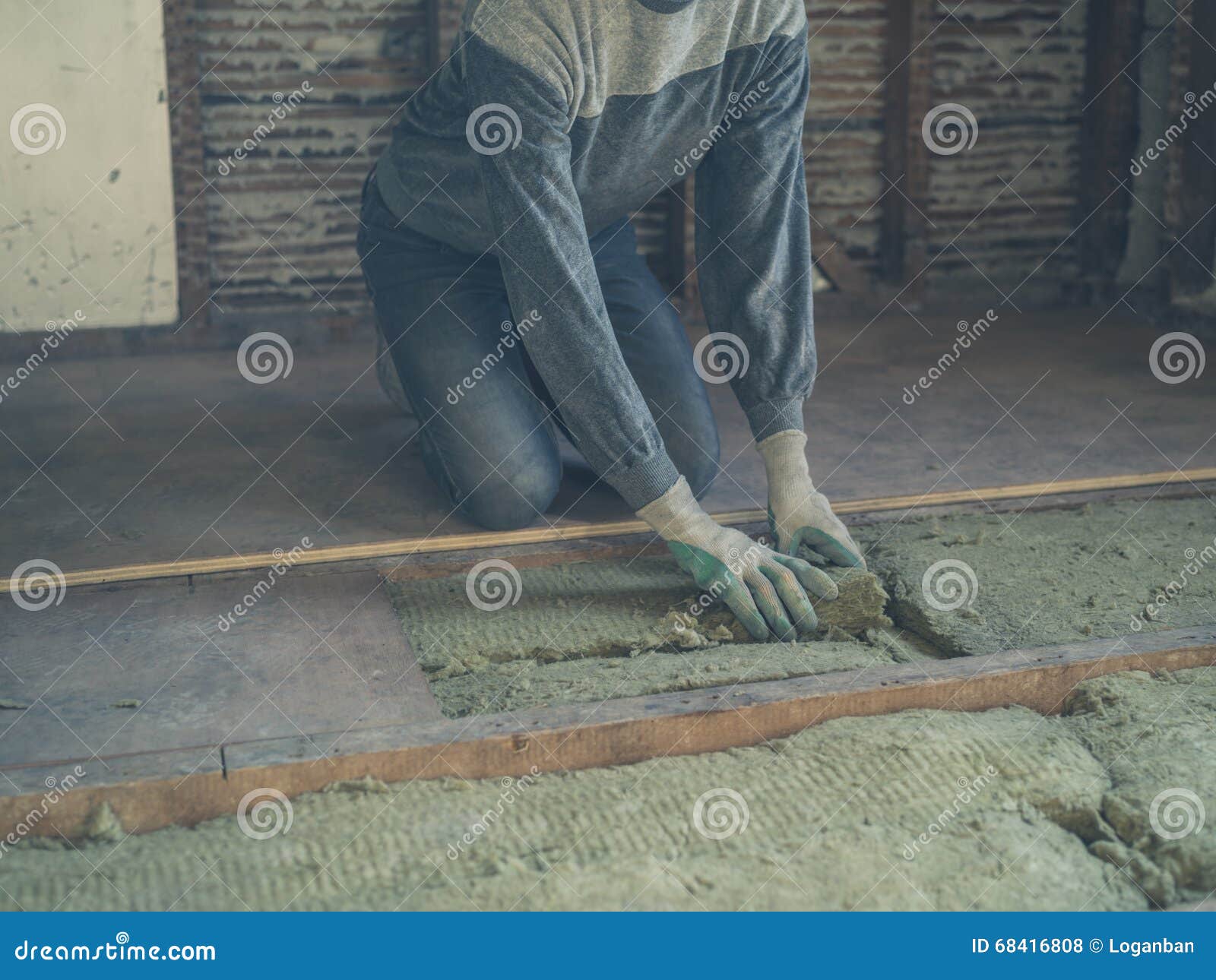 Young Woman Laying Insulation in Loft Stock Photo - Image of ...
