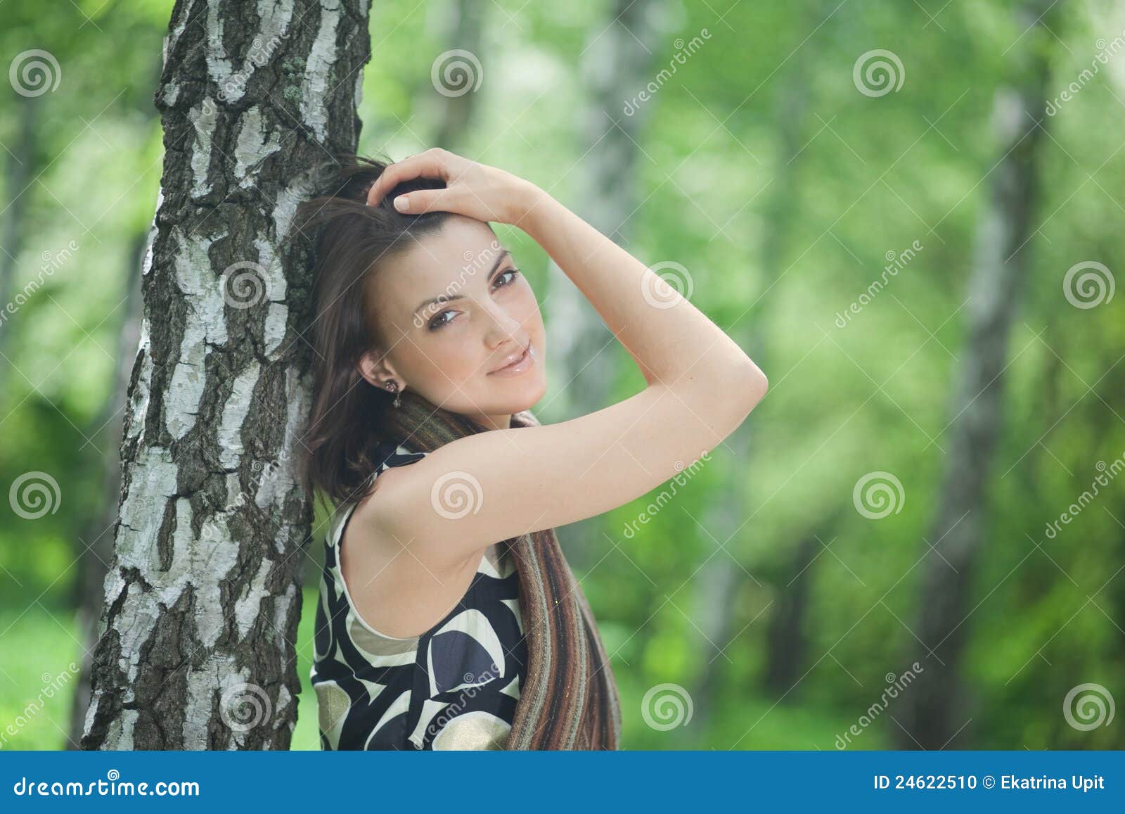 Young Woman Leaning Against a Tree Stock Photo - Image of happy, park ...
