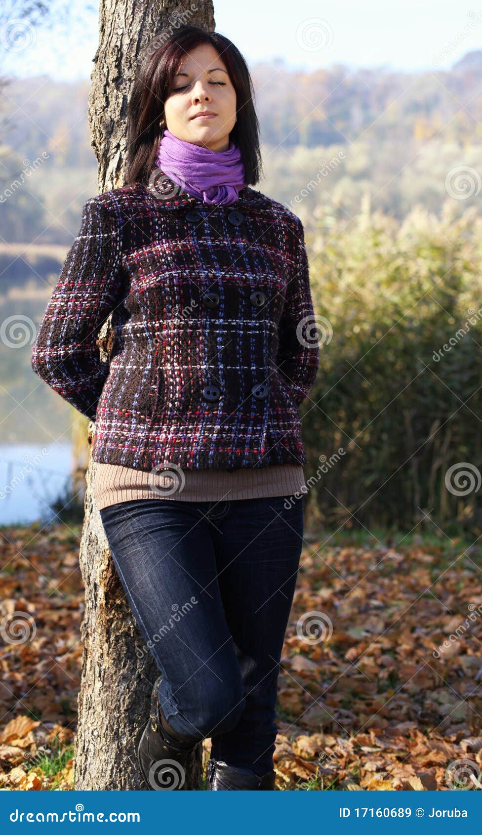Young Woman Leaning Against a Tree in Autumn Stock Image - Image of ...