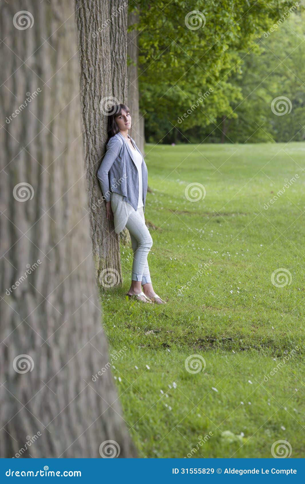 Young Woman Leaning Against a Tree Stock Image - Image of summer ...