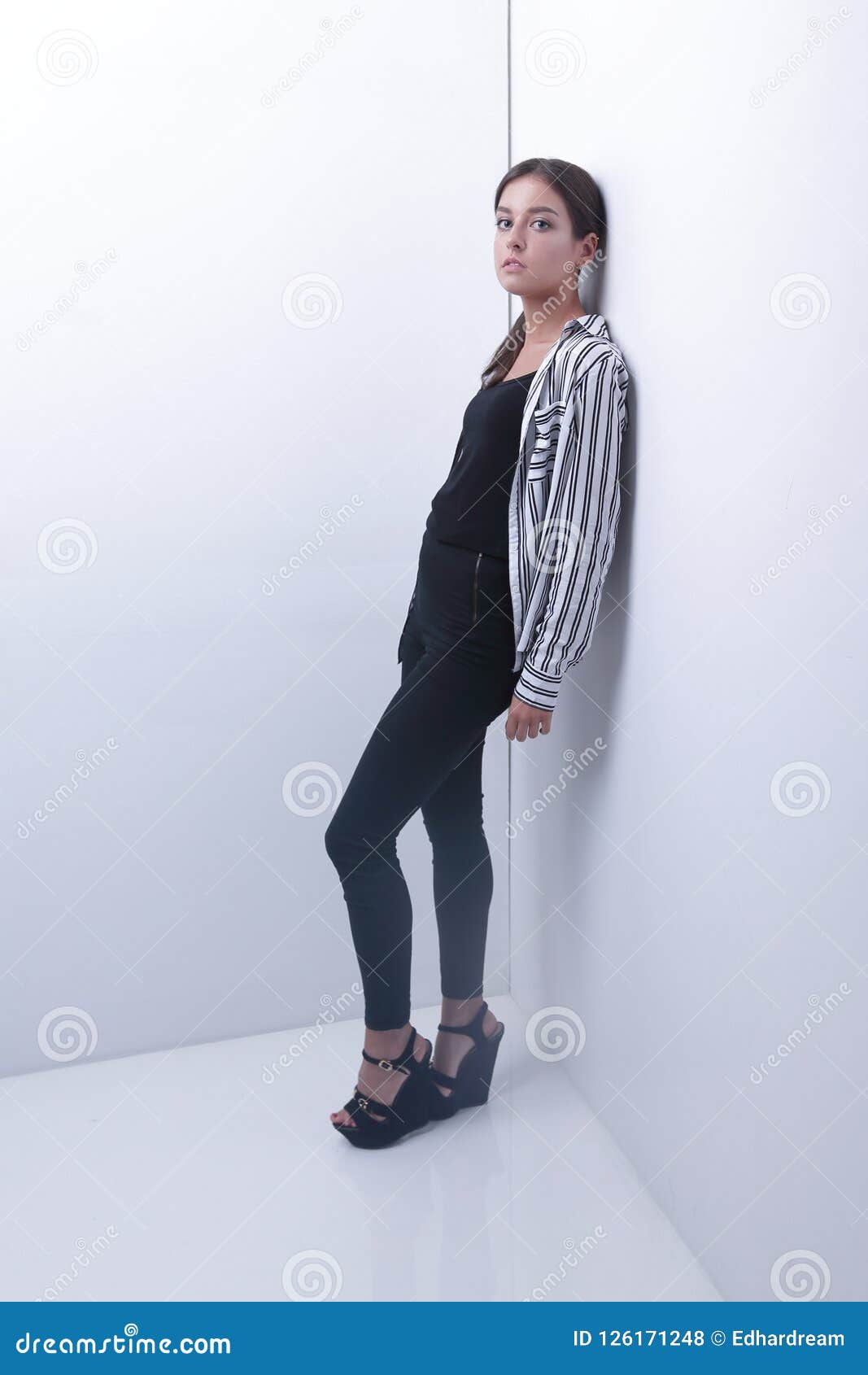 Young Woman Leaning on Wall. Stock Photo - Image of blue, cute: 126171248