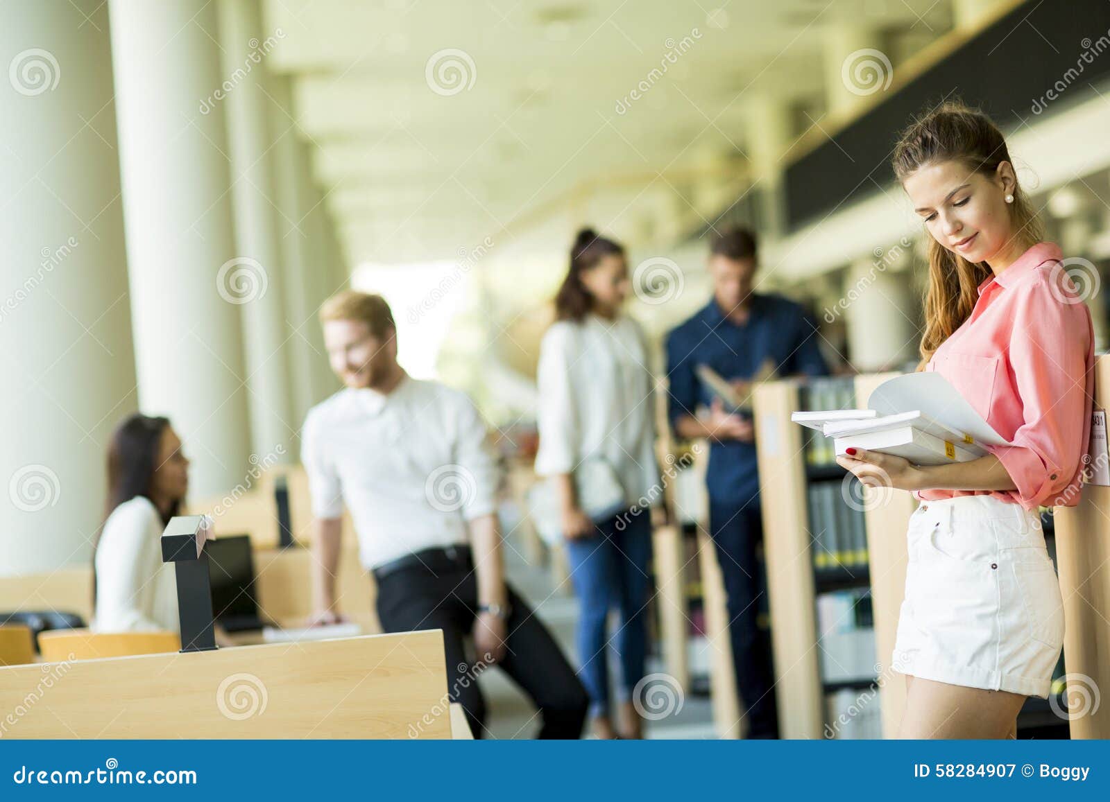 Young woman in the library stock image. Image of bookshelf - 58284907