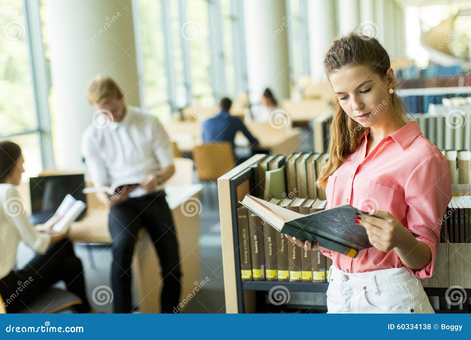 Young woman in the library stock photo. Image of bookcase - 60334138