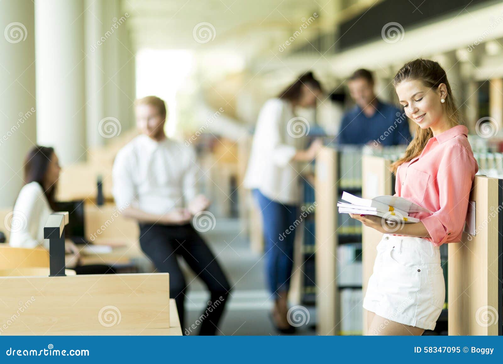 Young woman in the library stock image. Image of indoor - 58347095