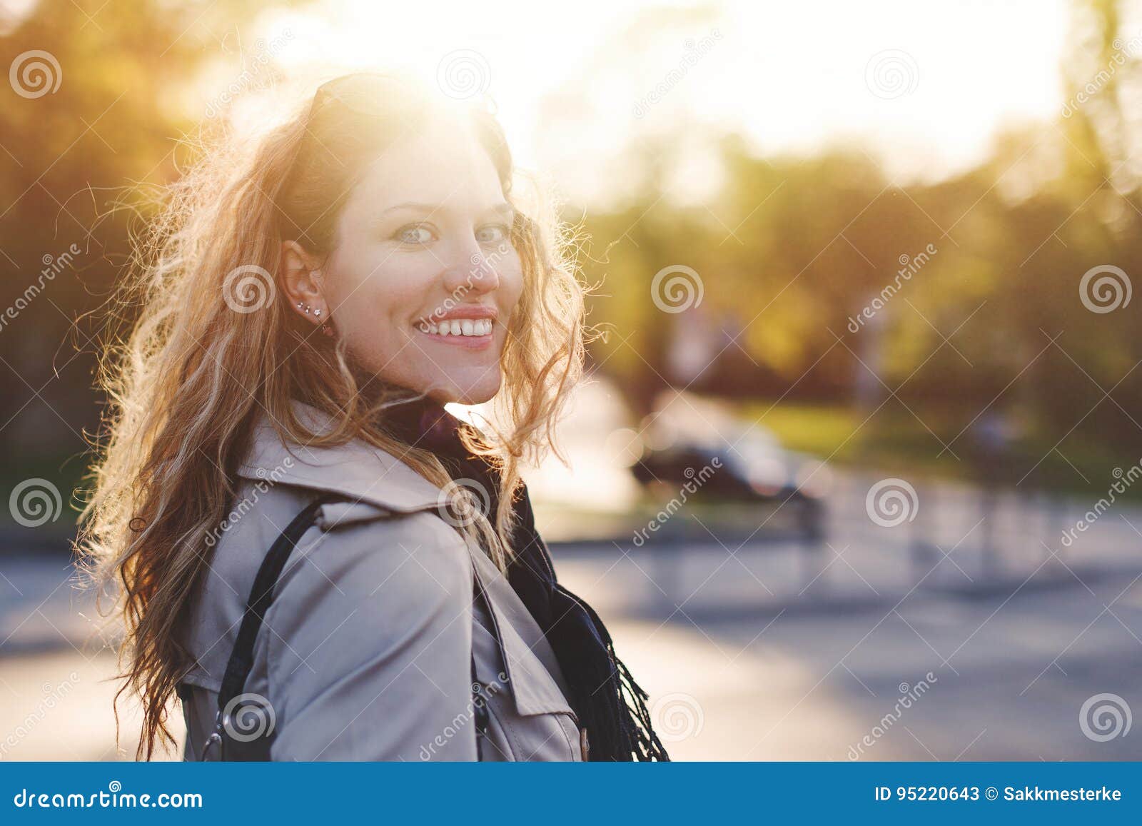 Young Woman Looking Back in Park Stock Image - Image of outdoor, cute ...