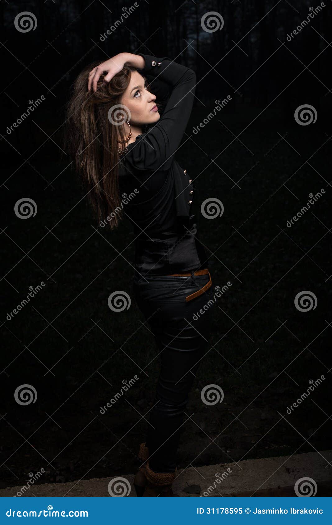 Young Woman Looking Behind Her Shoulder and Looking Up Stock Image ...