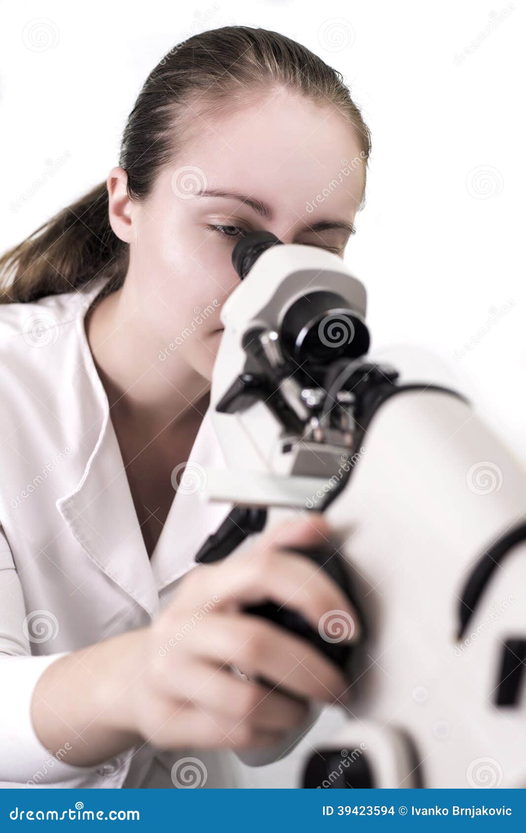 Young Woman Looking through Microscope Stock Photo - Image of ...