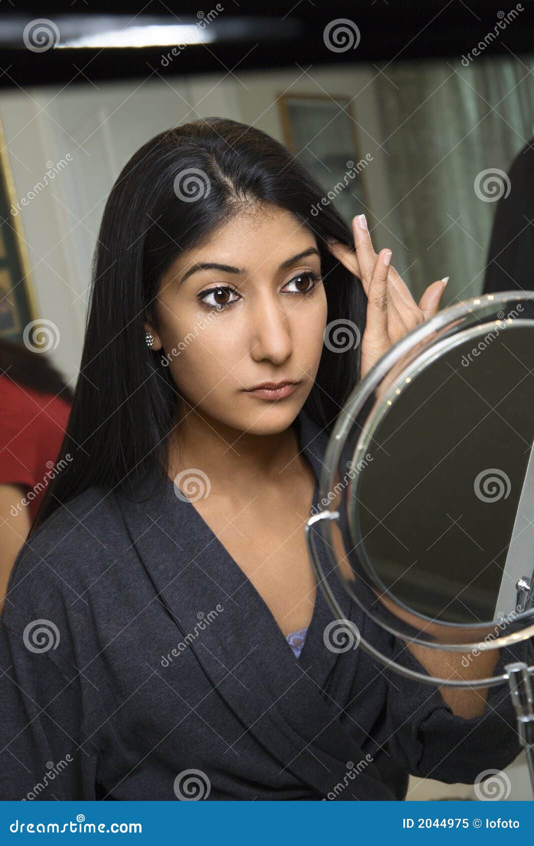 Young Woman Looking in Mirror. Stock Image - Image of home, makeup: 2044975