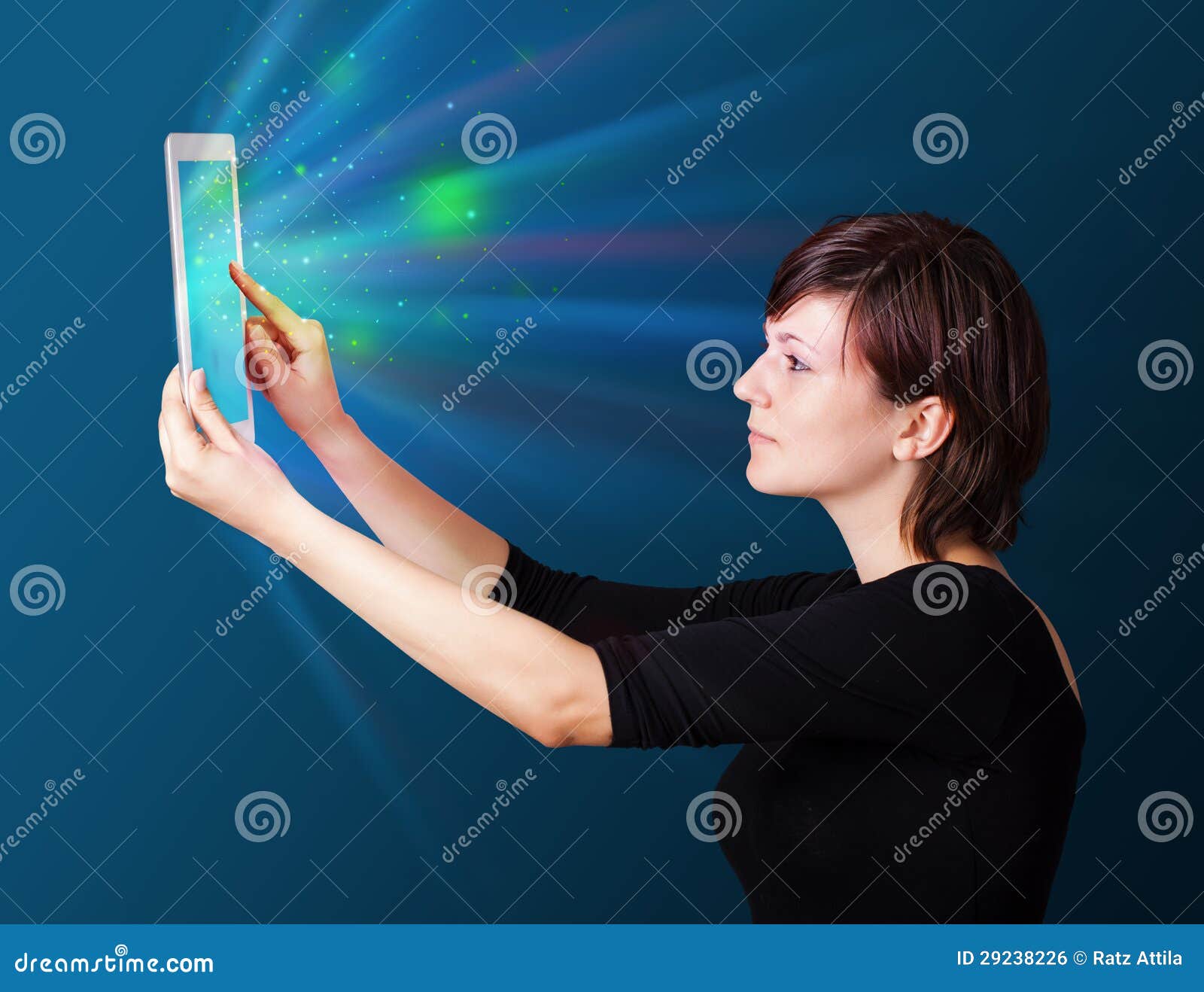Young Woman Looking at Modern Tablet with Abstract Lights Stock Photo ...