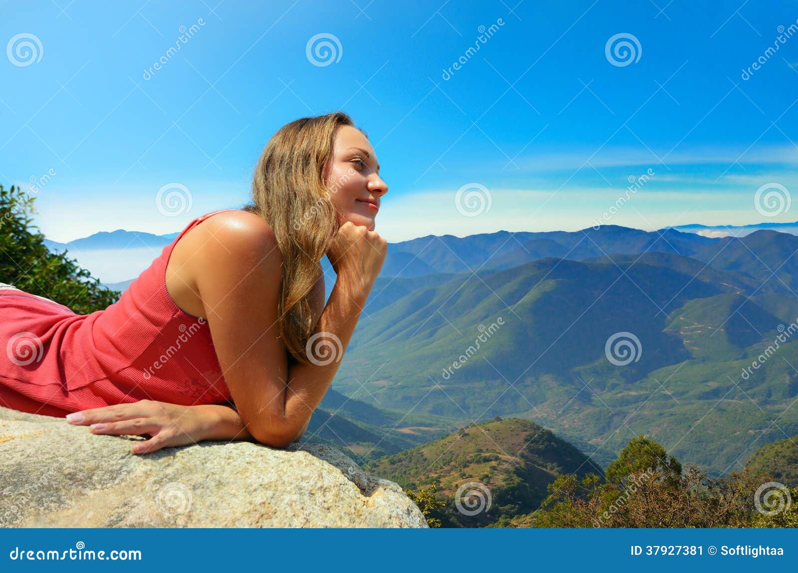 Young Woman Looking at the Mountains on the Edge of a Cliff Stock Image ...