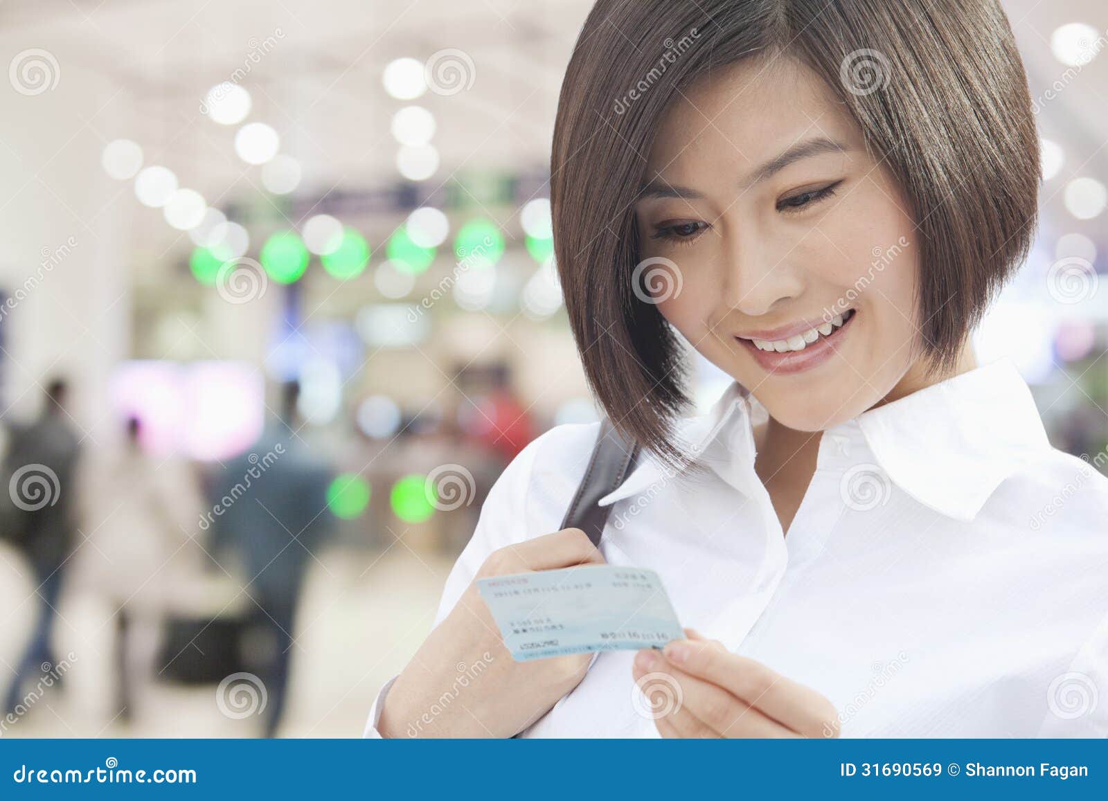 Young Woman Looking at a Train Ticket Stock Image - Image of ...